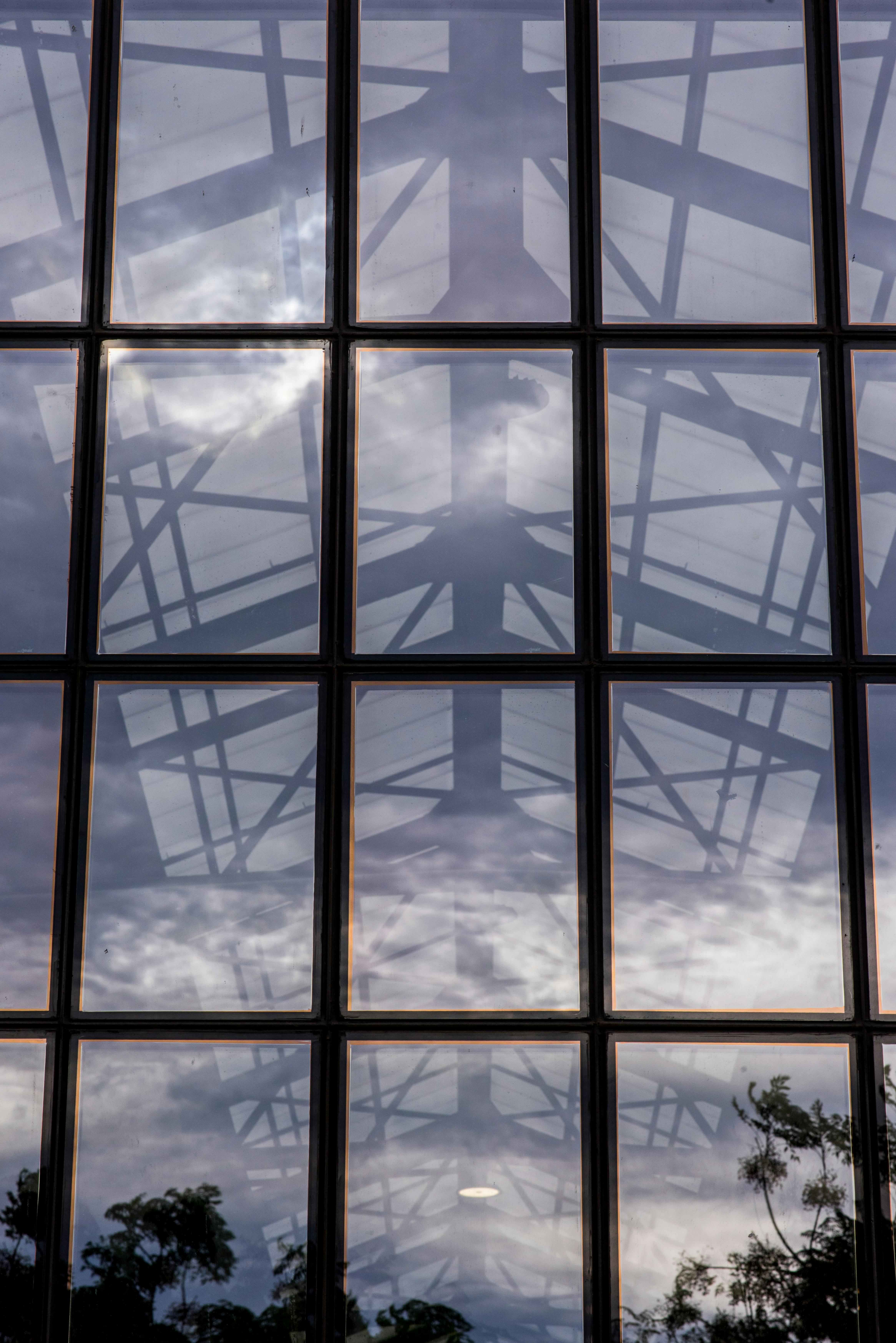 Architectural Reflection on Glass Facade · Free Stock Photo