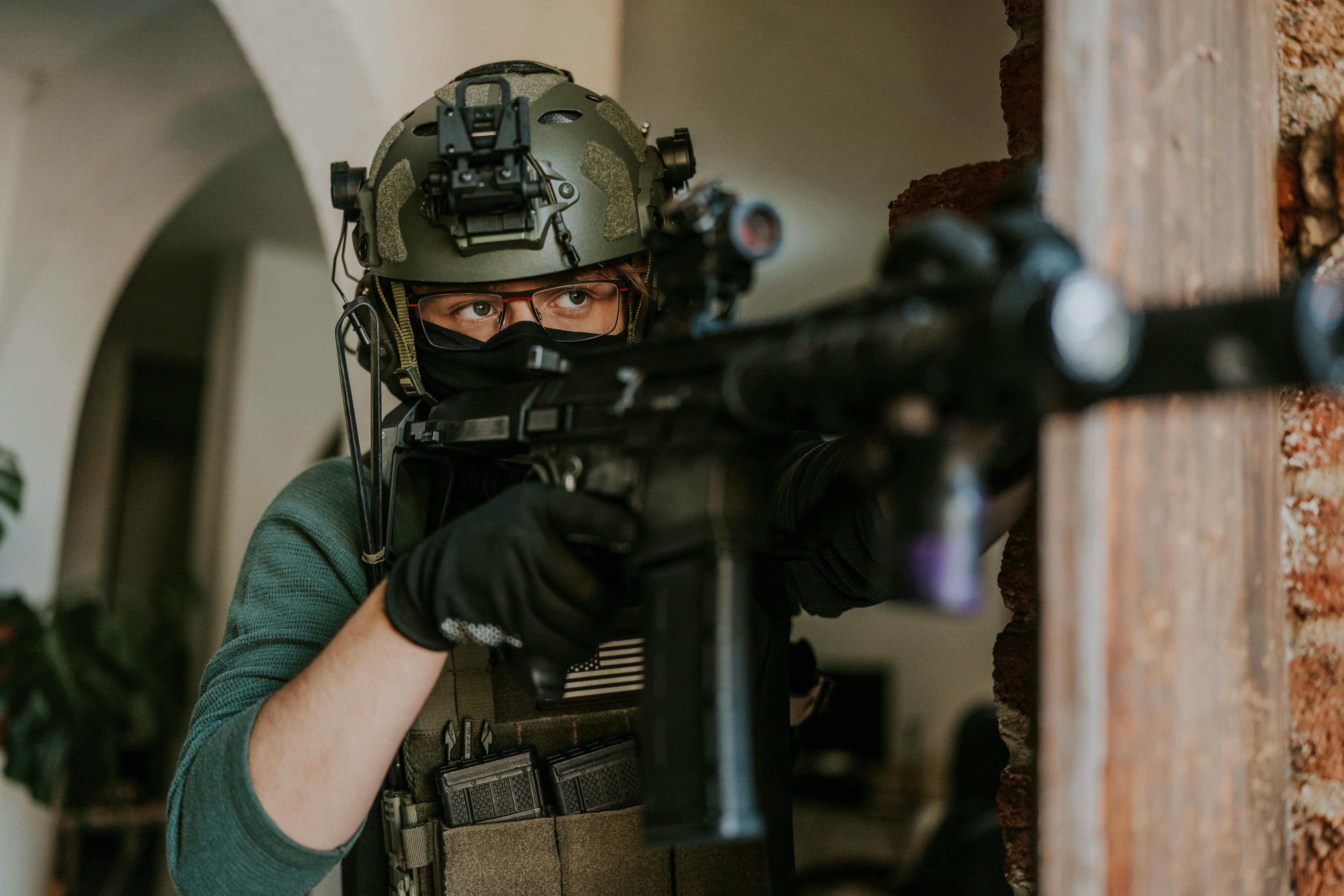 Tactical Soldier Aiming with Precision Indoors · Free Stock Photo