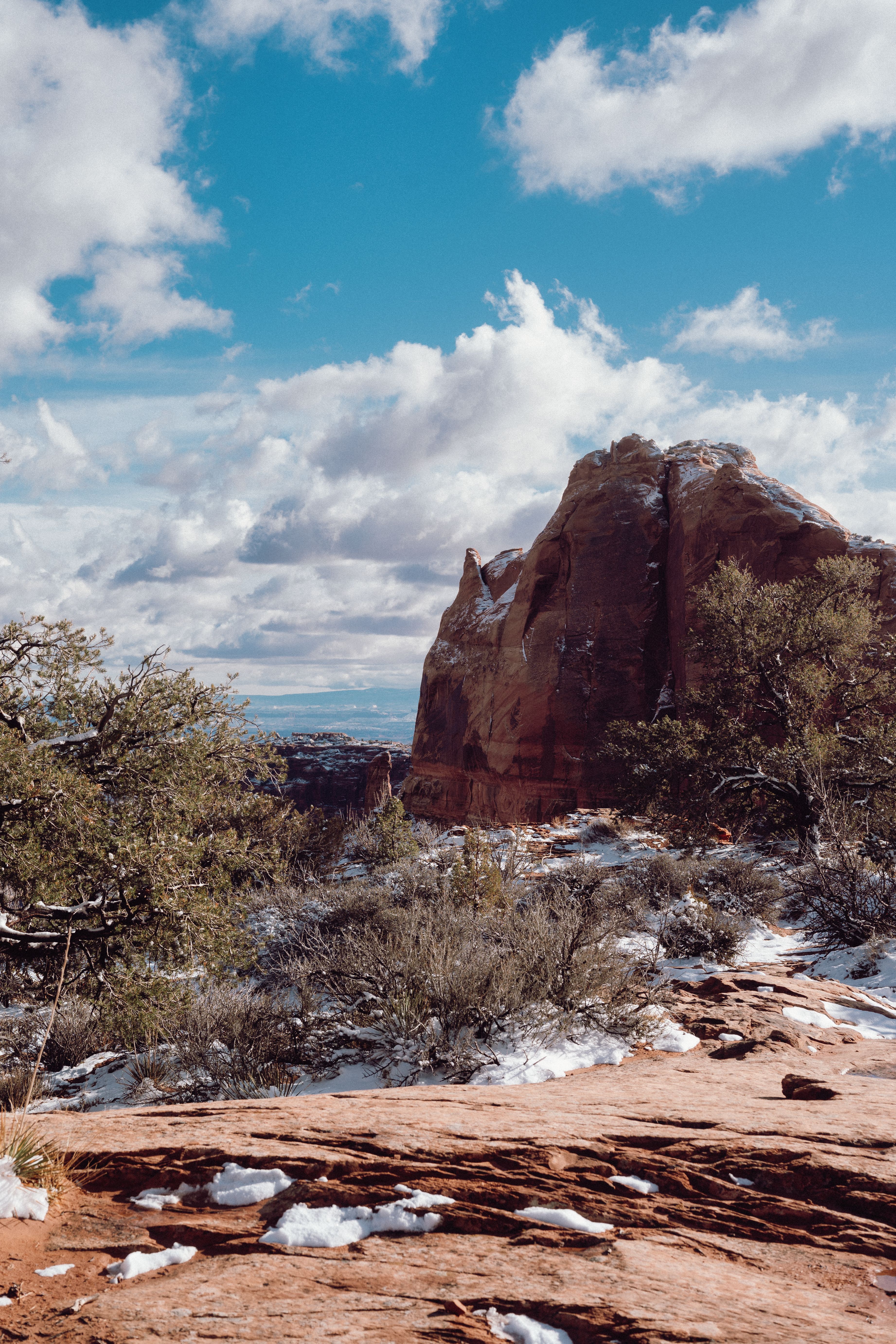 Snowy Desert Landscape with Red Rock Formation · Free Stock Photo