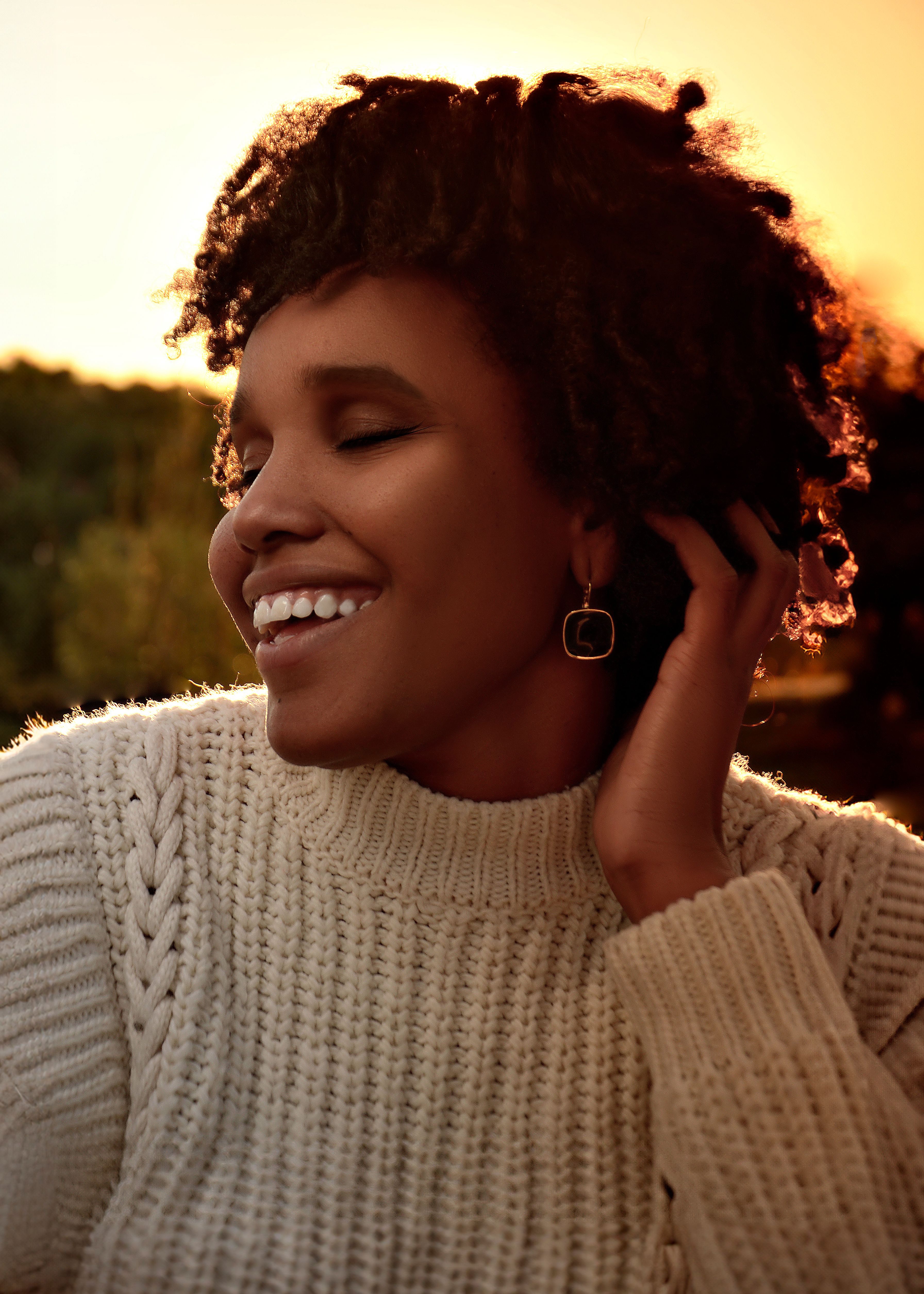 Warm Sunset Portrait with Joyful Expression · Free Stock Photo