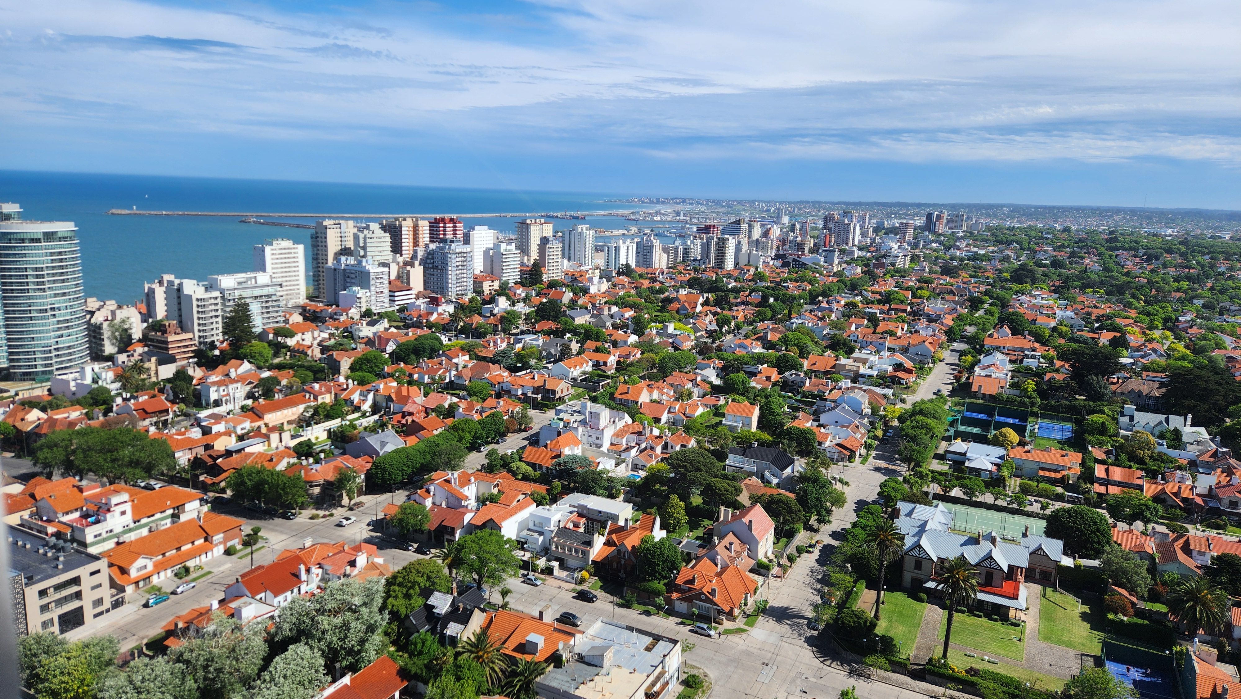Aerial View of Coastal City with Modern Skyline · Free Stock Photo