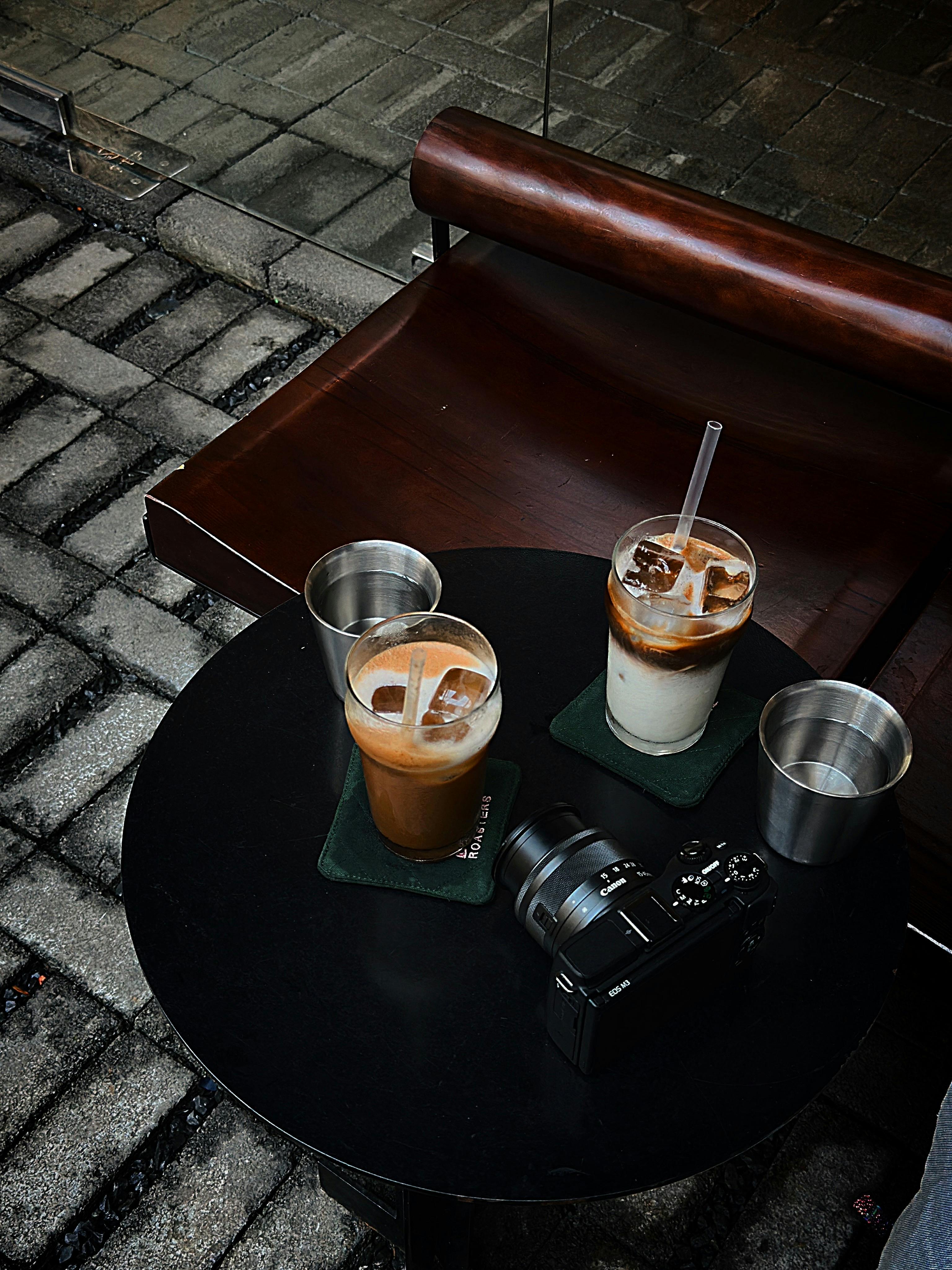 Cozy Outdoor Coffee Setting with Camera · Free Stock Photo
