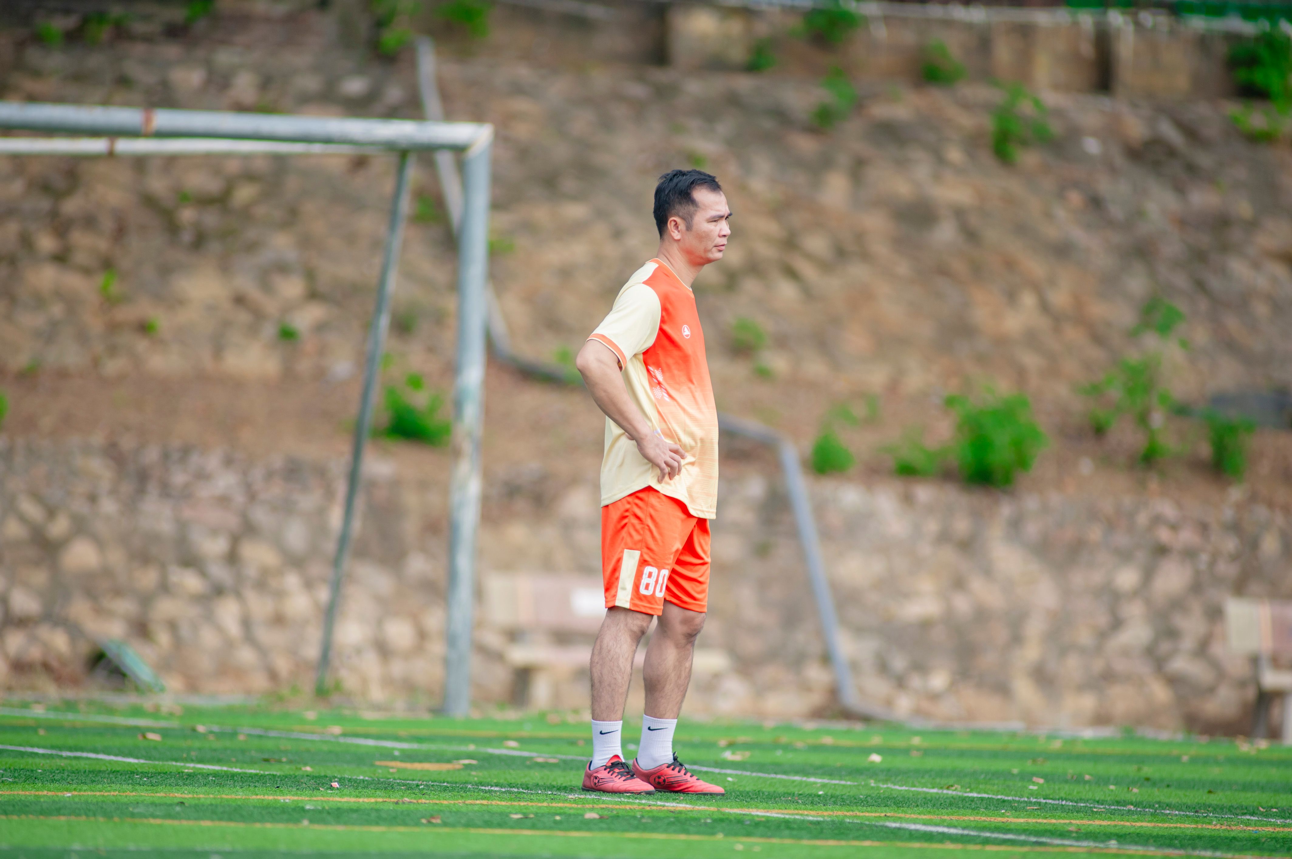 Man in Sports Attire Standing on Soccer Field · Free Stock Photo