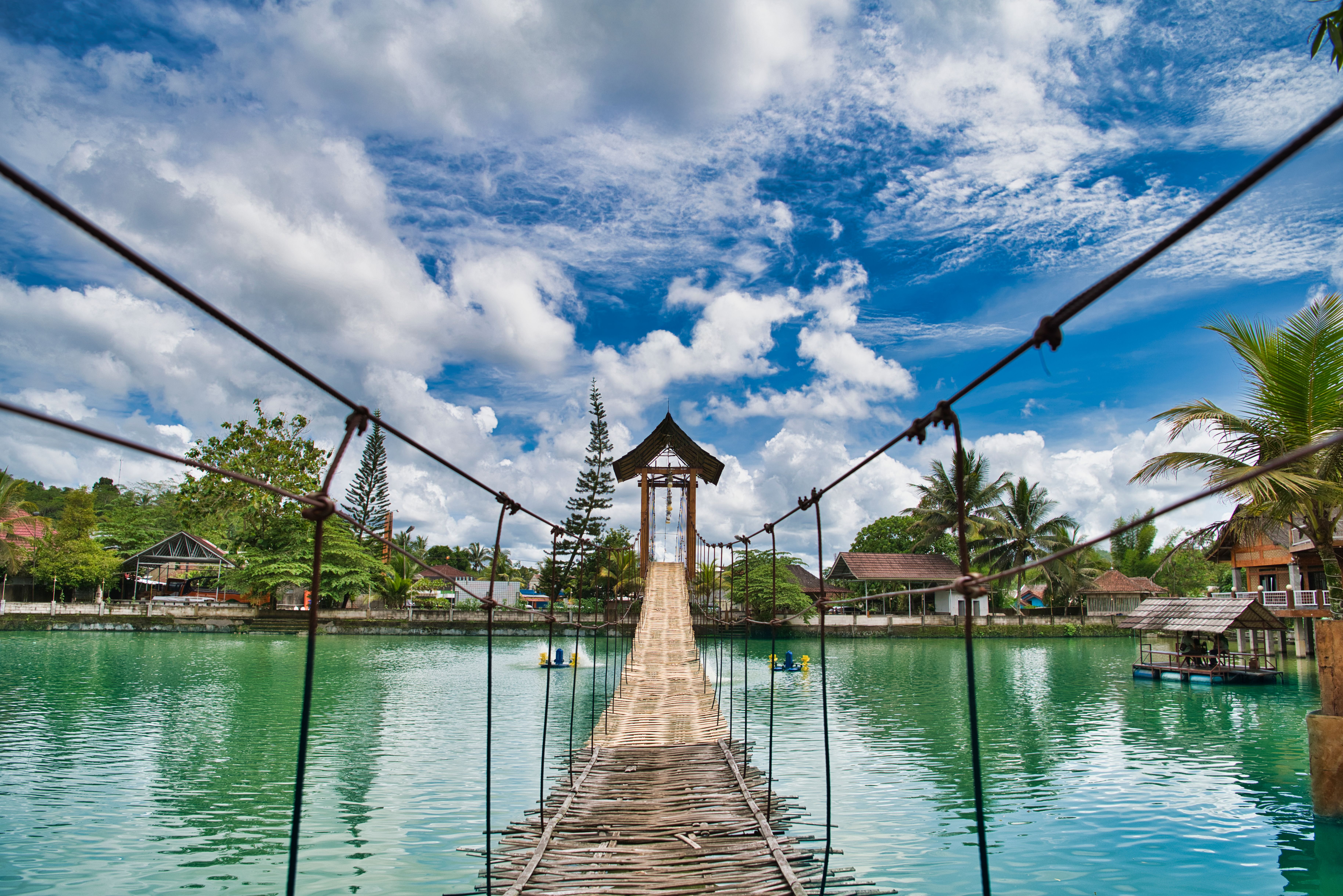 Suspension Bridge Over Tranquil Tropical Lagoon · Free Stock Photo