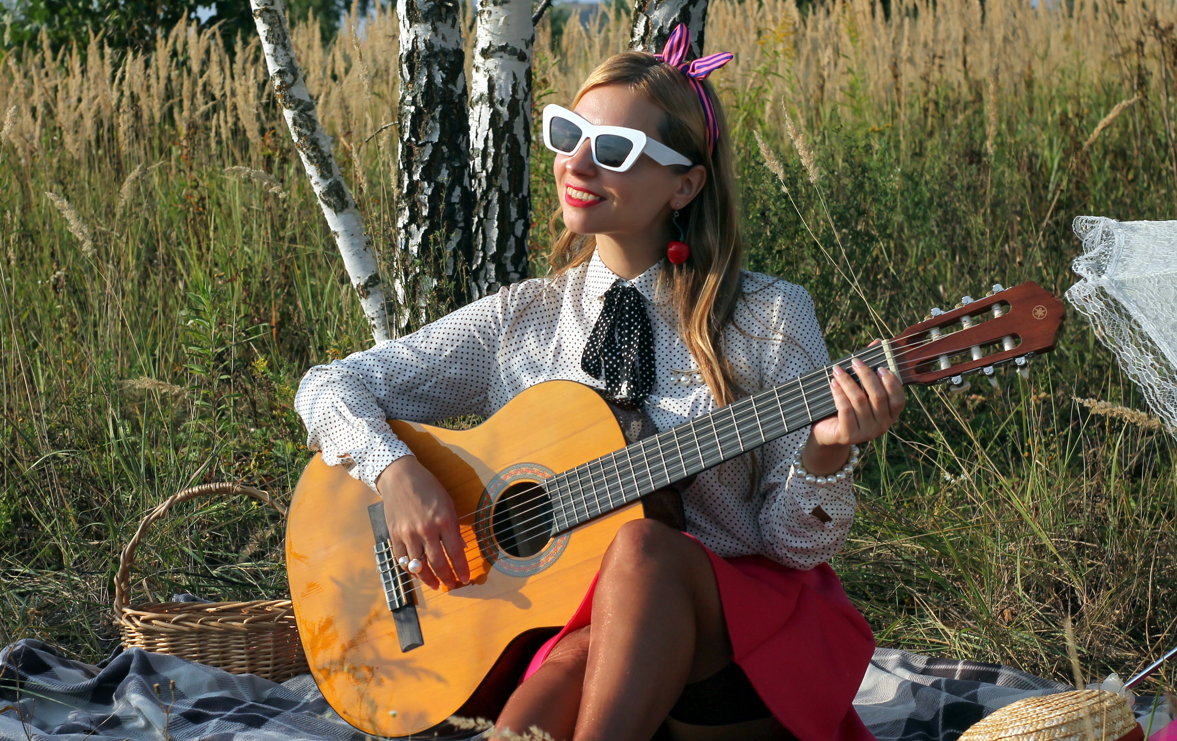 Woman Playing Guitar Outdoors in Summer · Free Stock Photo
