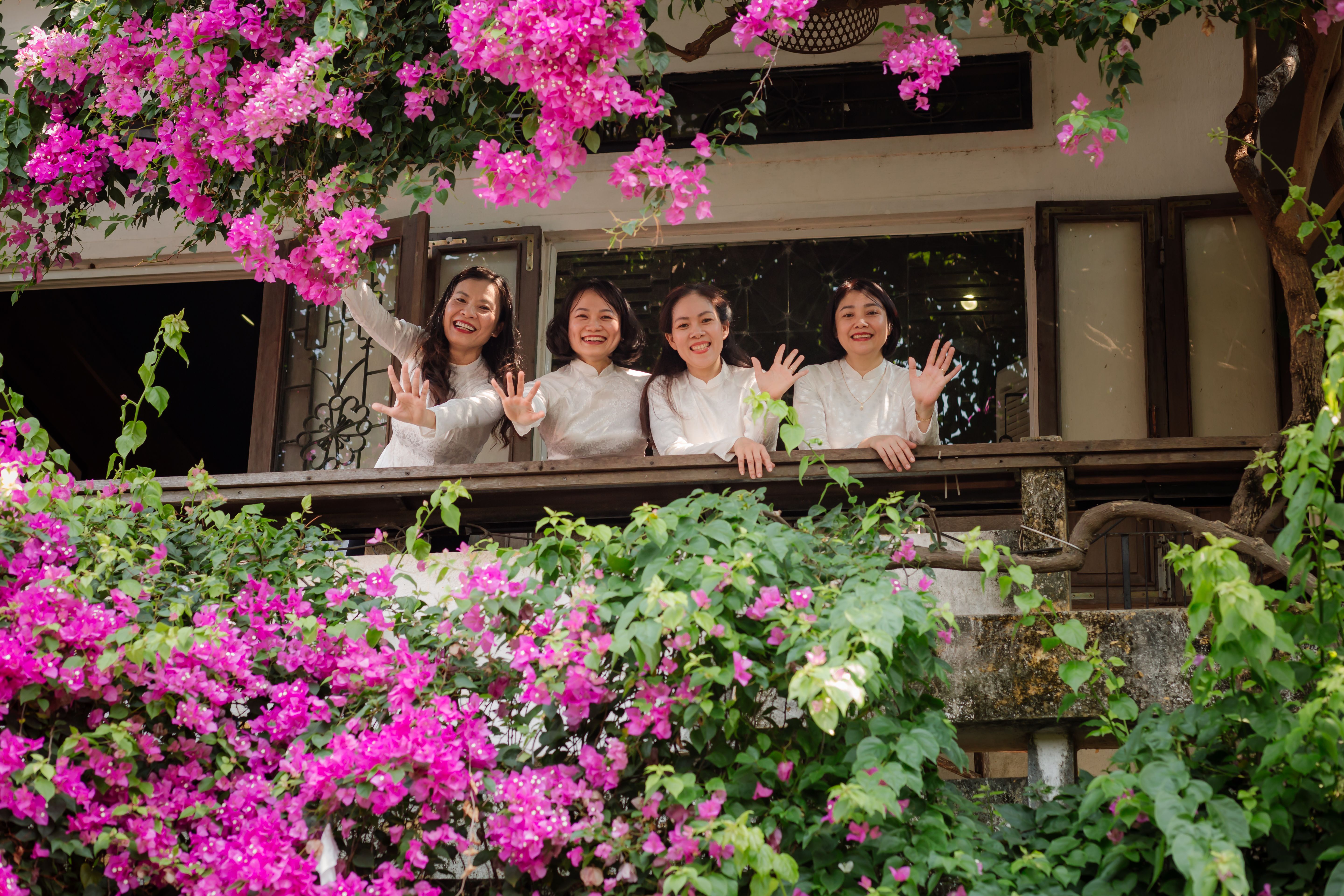 Women in Traditional Dress on a Balcony in Hội An · Free Stock Photo