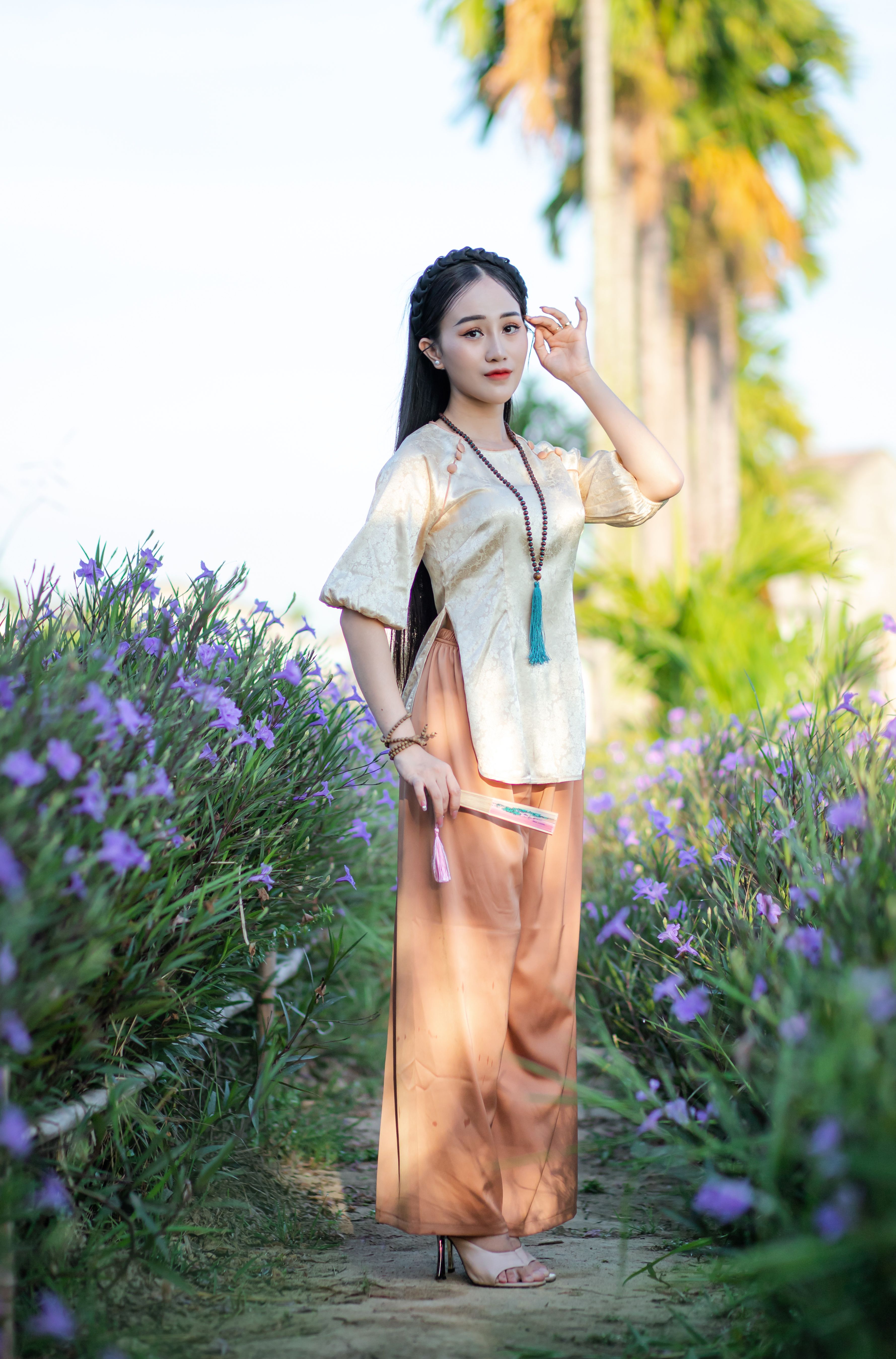 Traditional Vietnamese Fashion in Hoi An Garden · Free Stock Photo