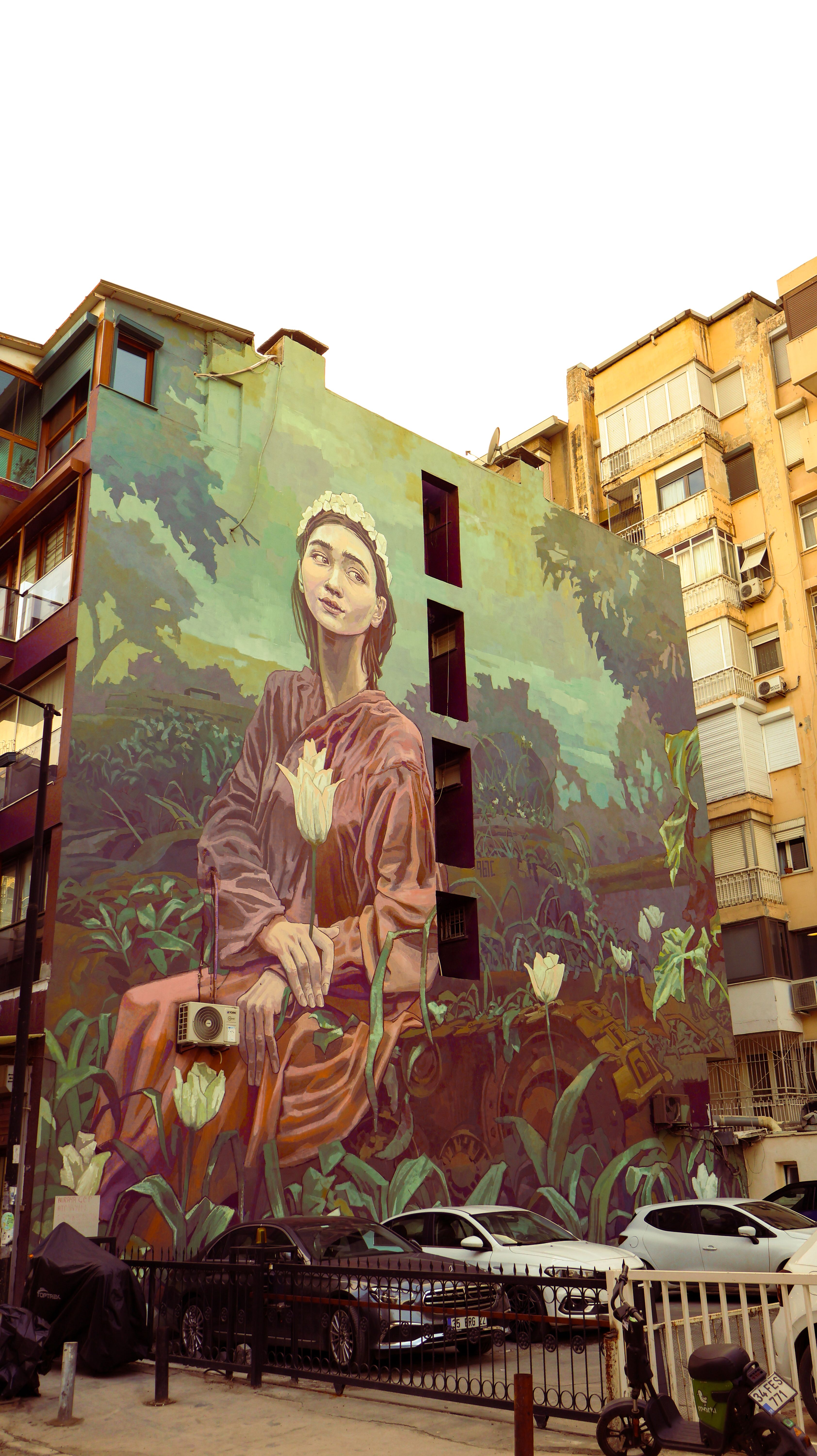 Vibrant Mural of Woman with Flowers on Urban Wall · Free Stock Photo