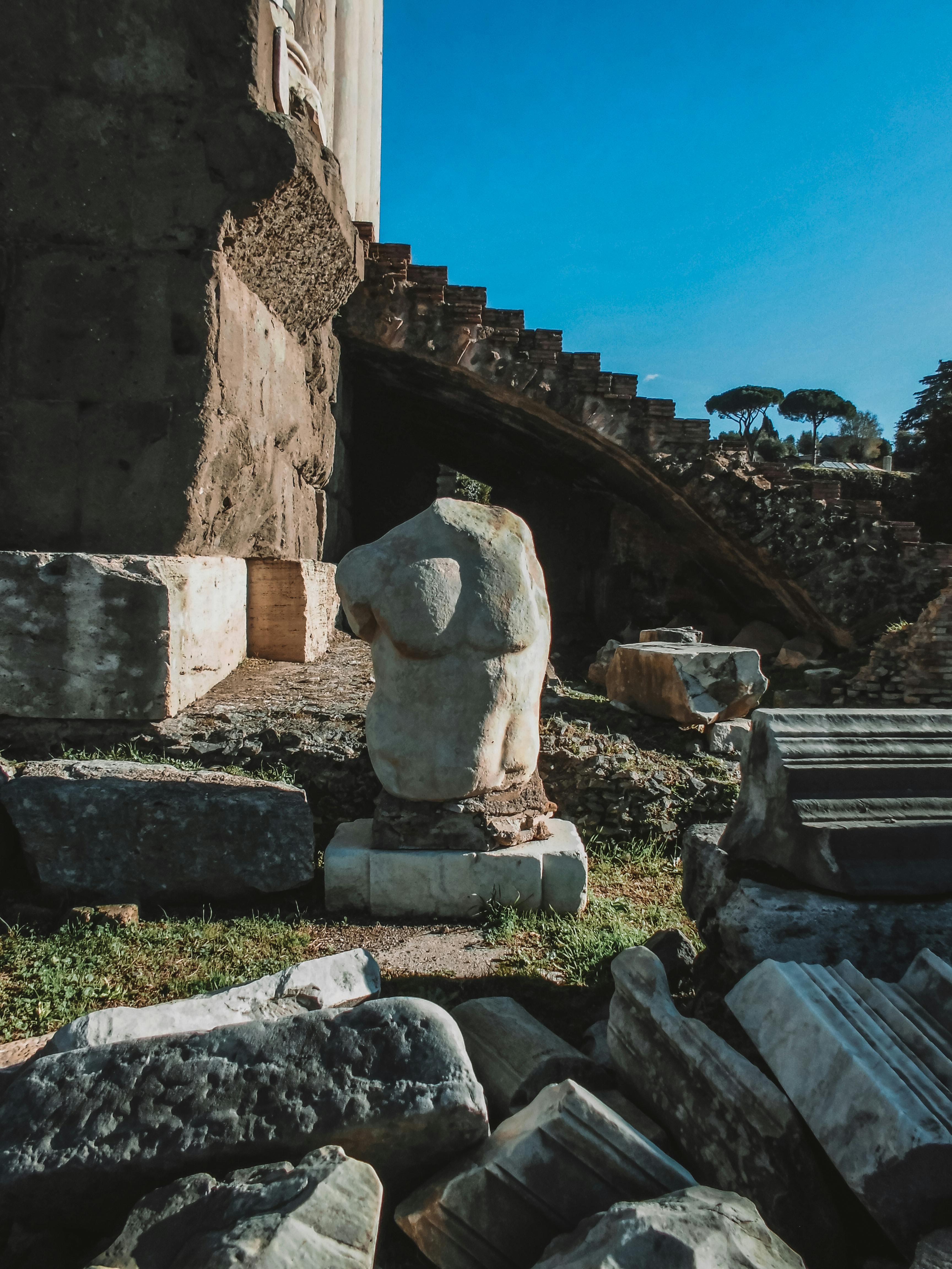 Ancient Roman Ruins with Broken Statue · Free Stock Photo