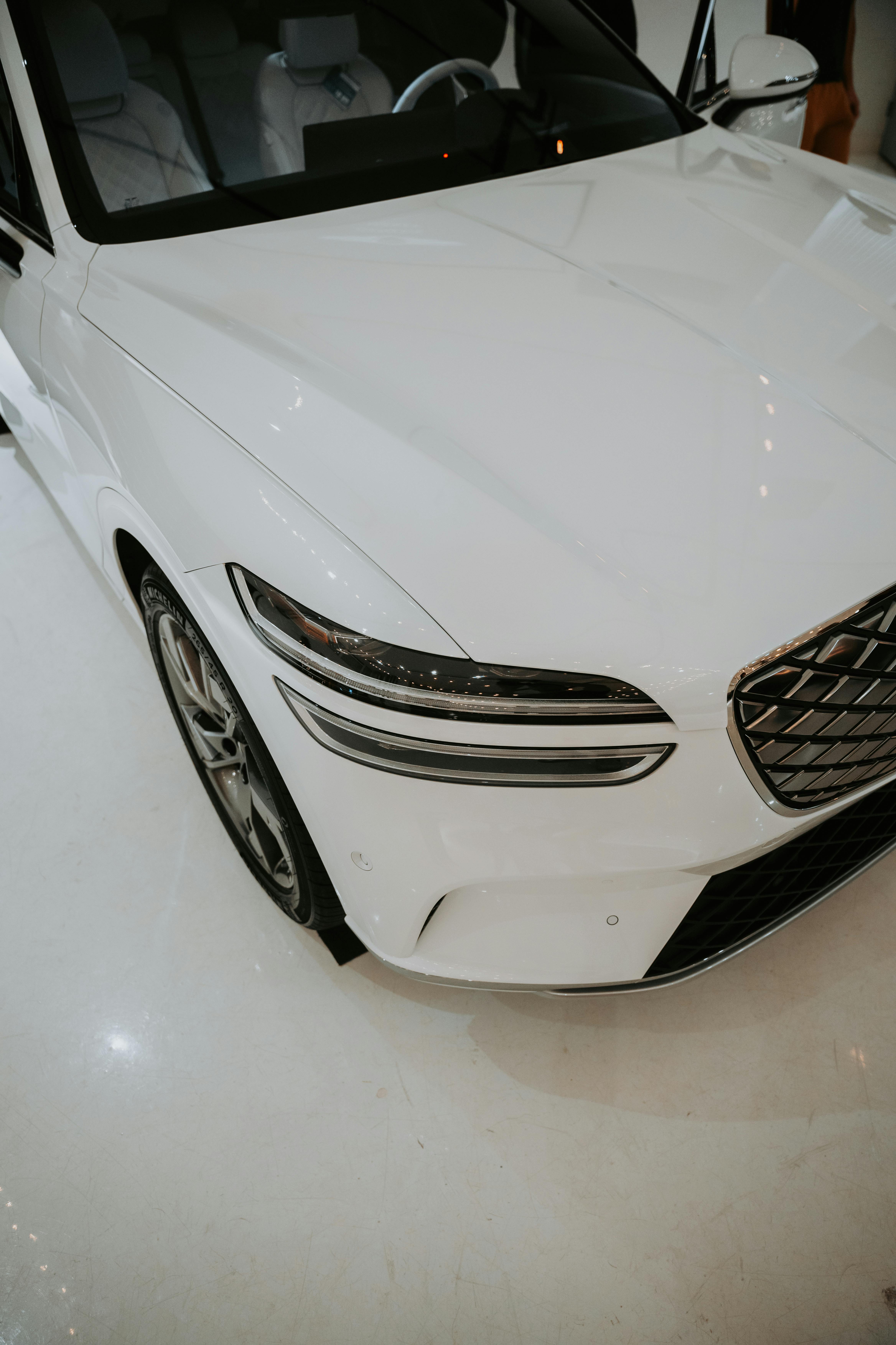 Luxury White Car in Showroom Display · Free Stock Photo