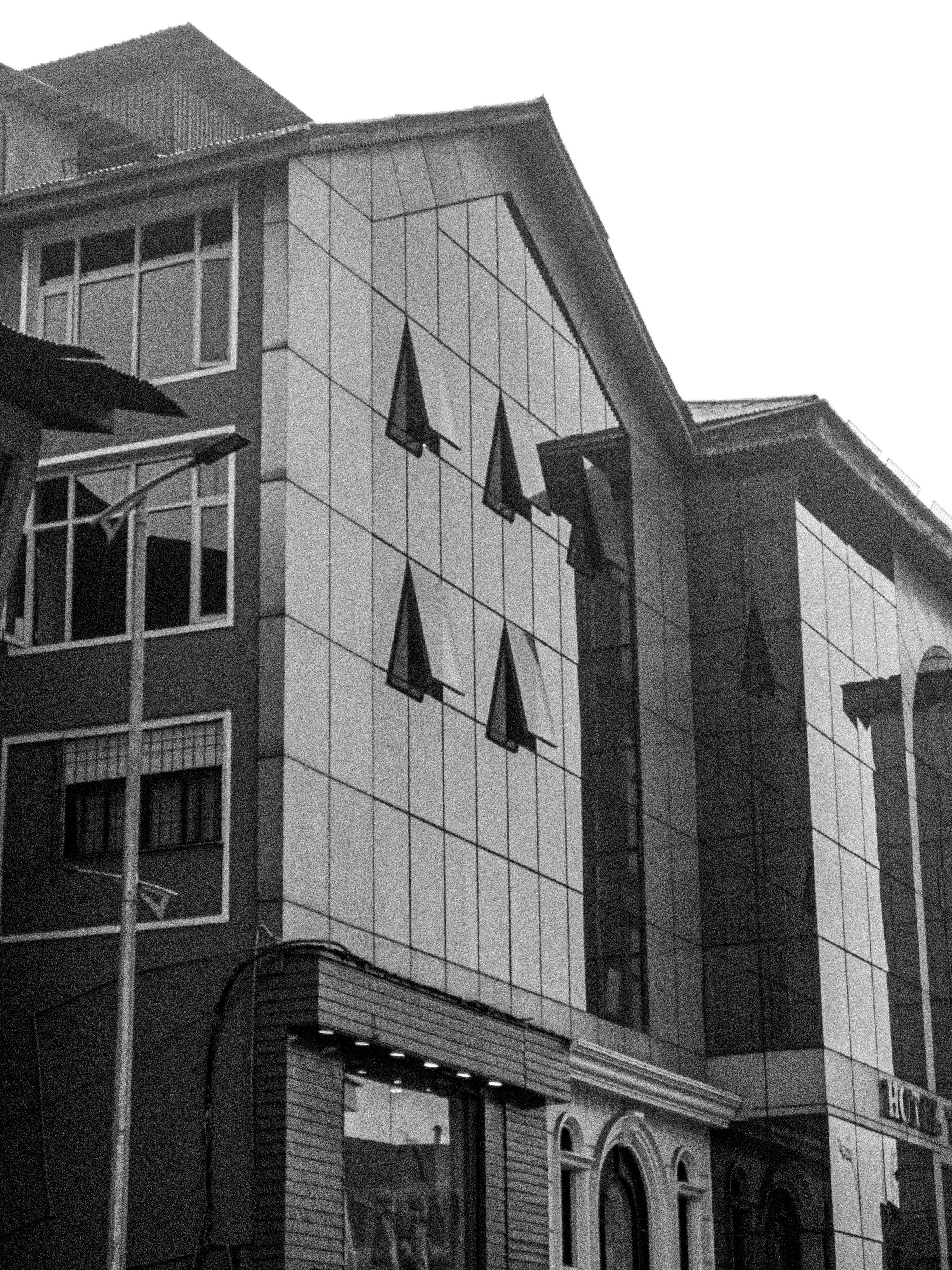 Modern Architectural Facade with Windows · Free Stock Photo