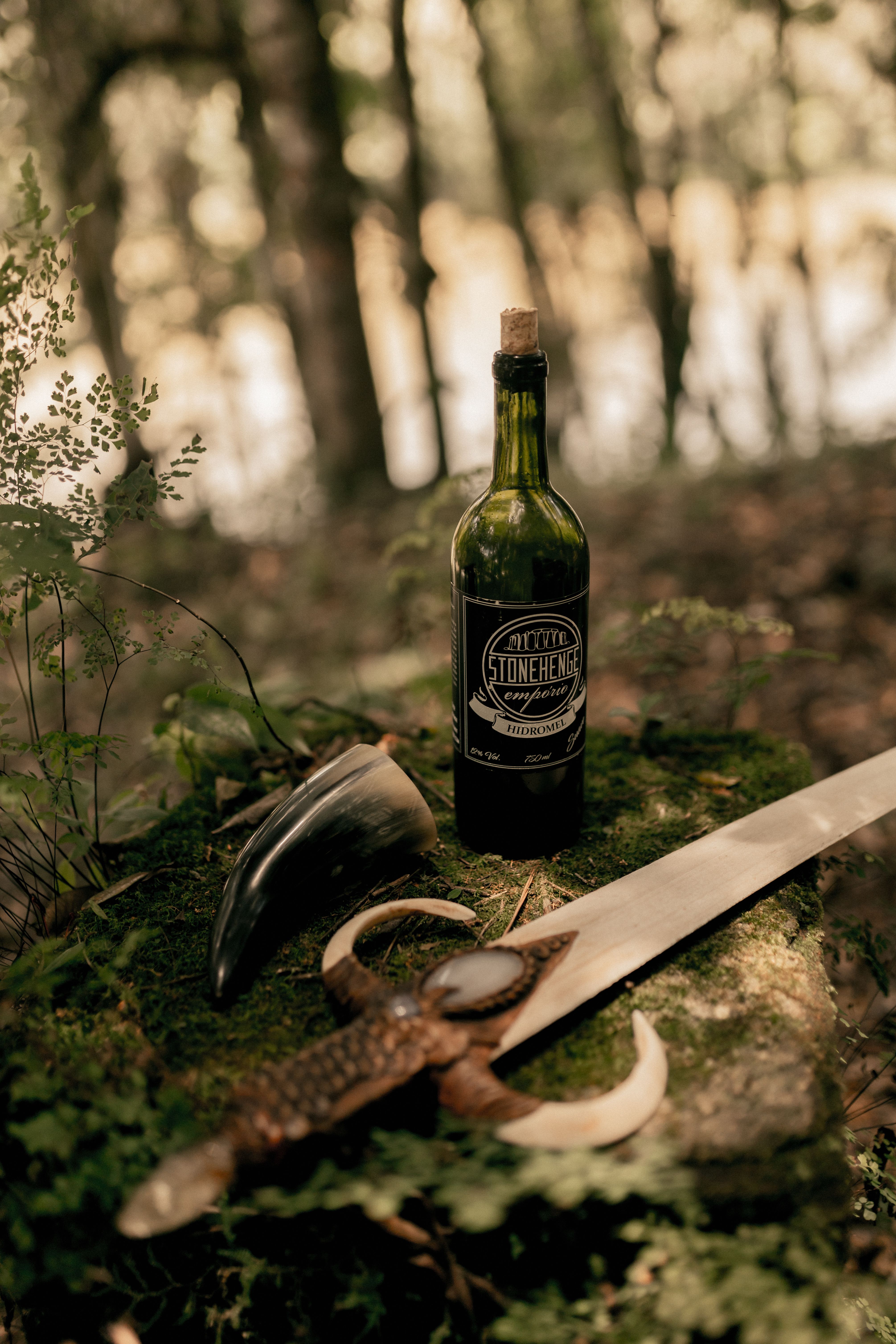 Medieval Stonehenge Mead with Sword in Forest Clearing · Free Stock Photo
