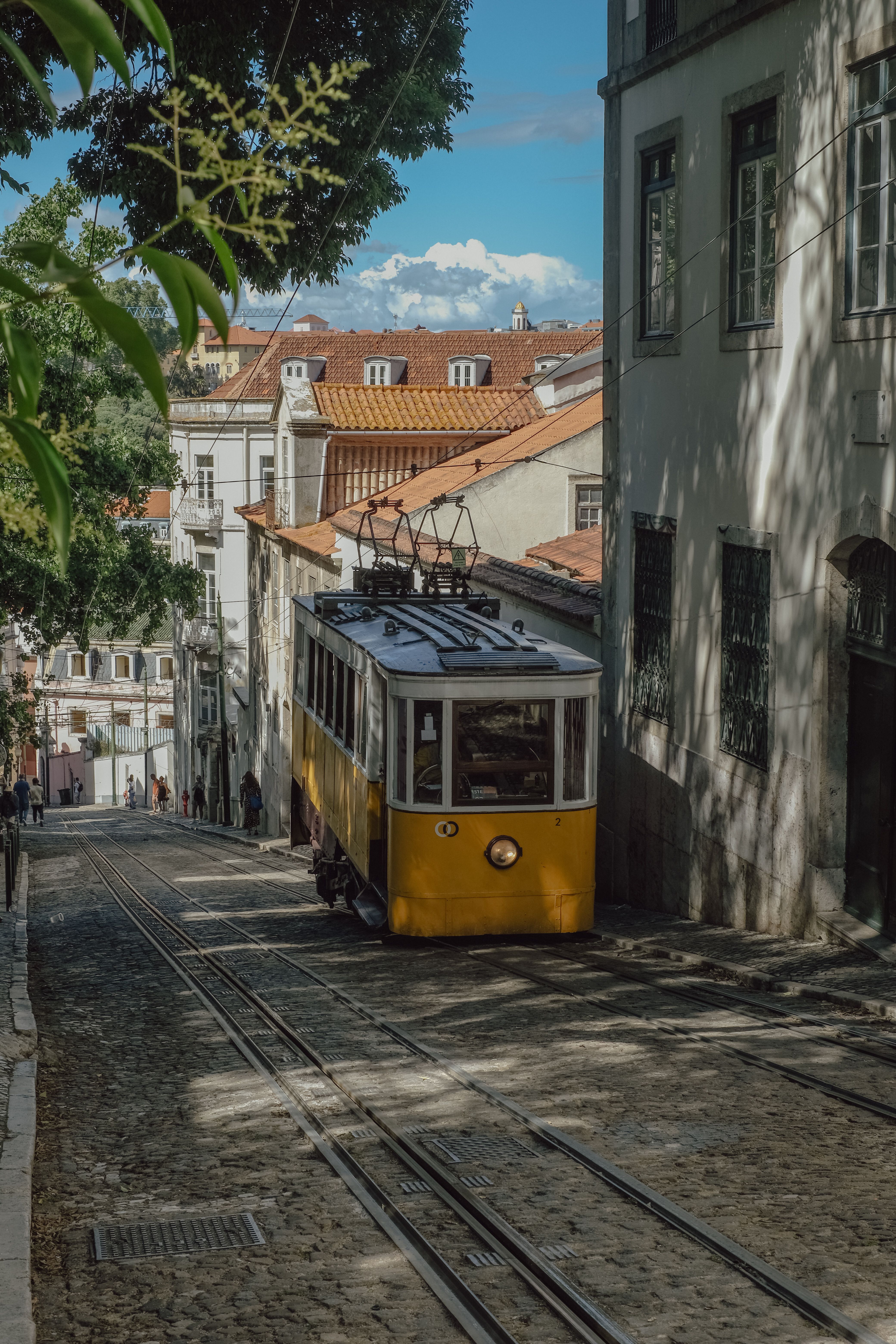 Historic Tram in a Quaint European Street · Free Stock Photo