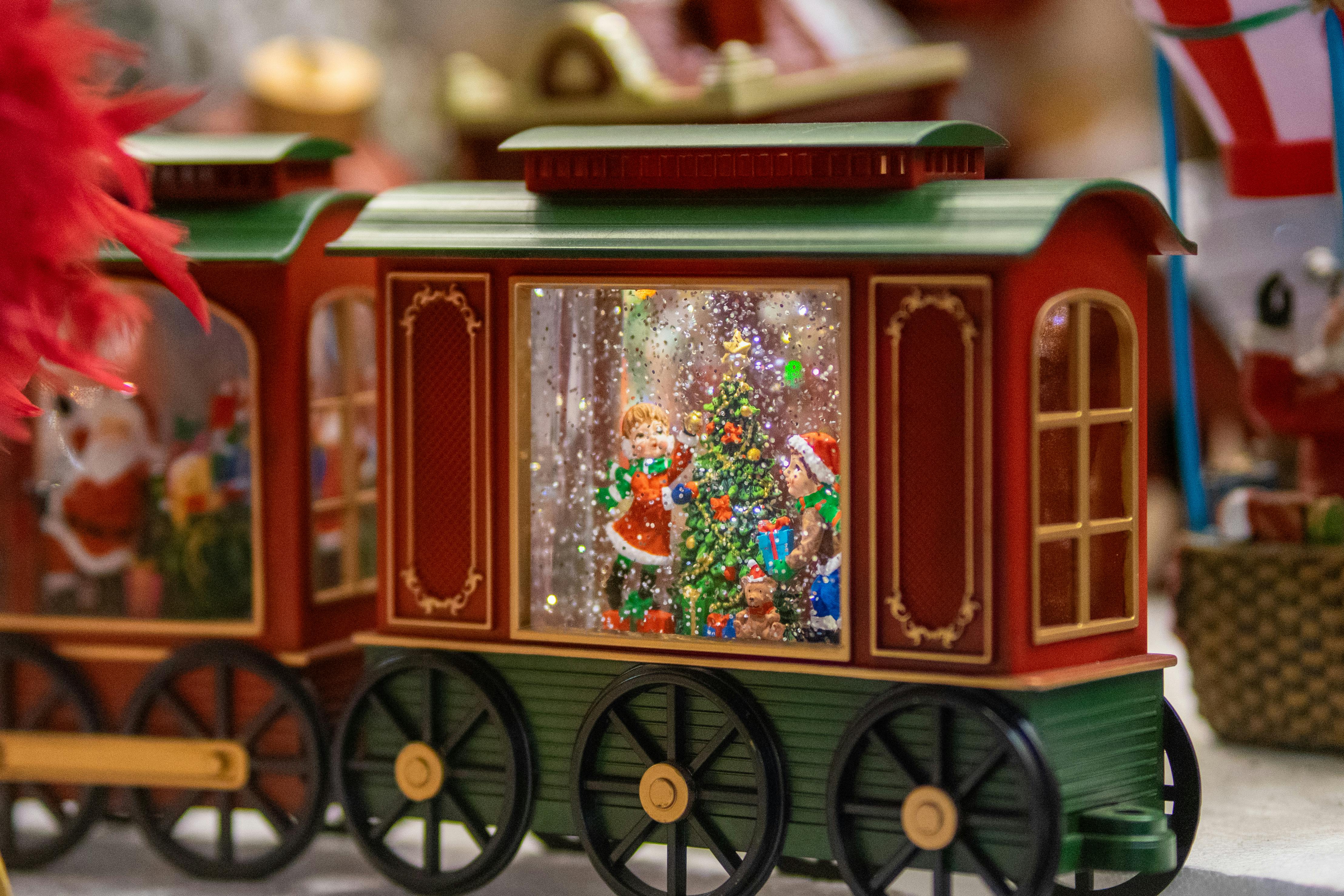 Festive Christmas Train Decoration with Snow · Free Stock Photo