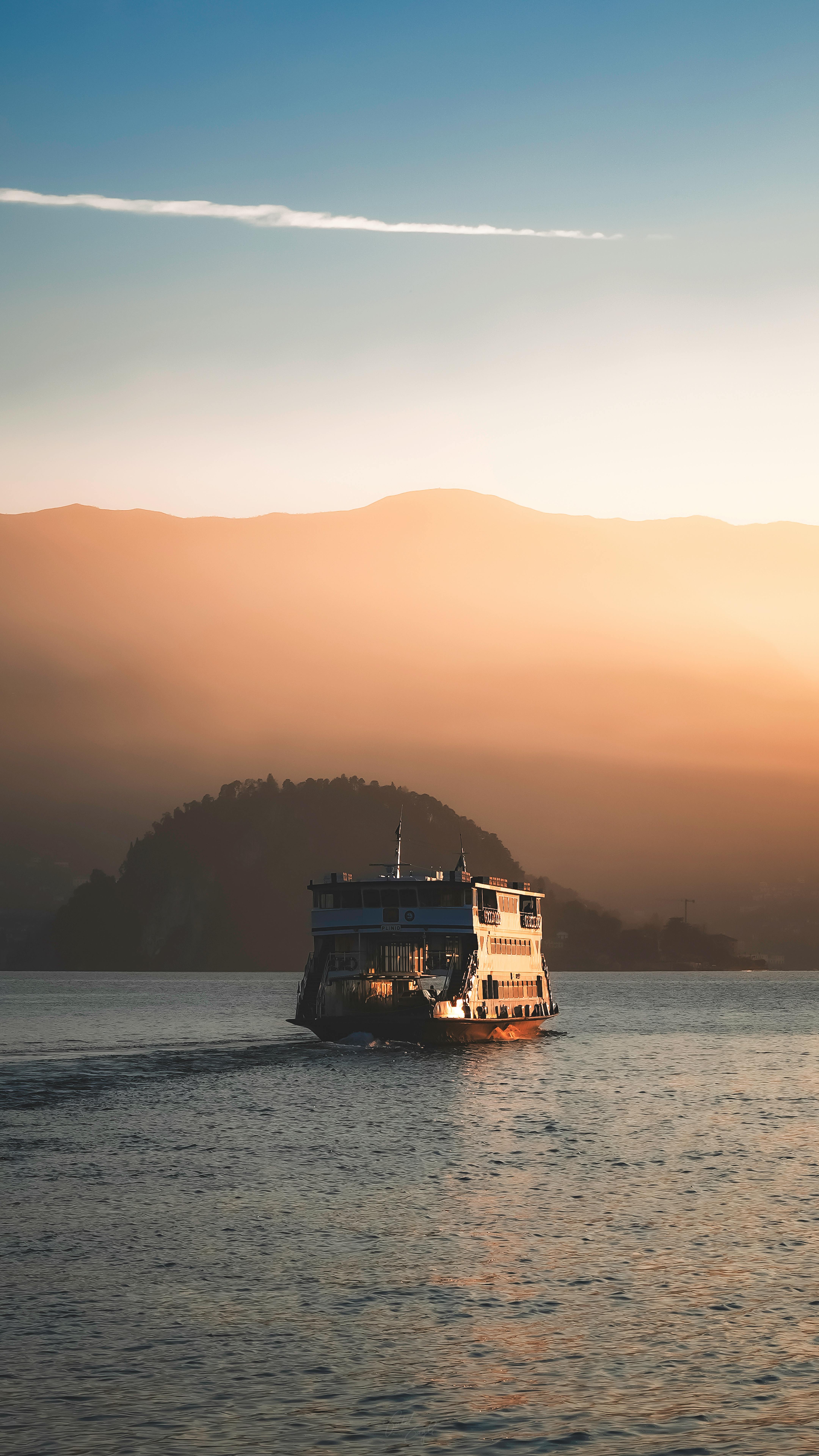 Scenic Ferry Ride at Sunset over Calm Waters · Free Stock Photo