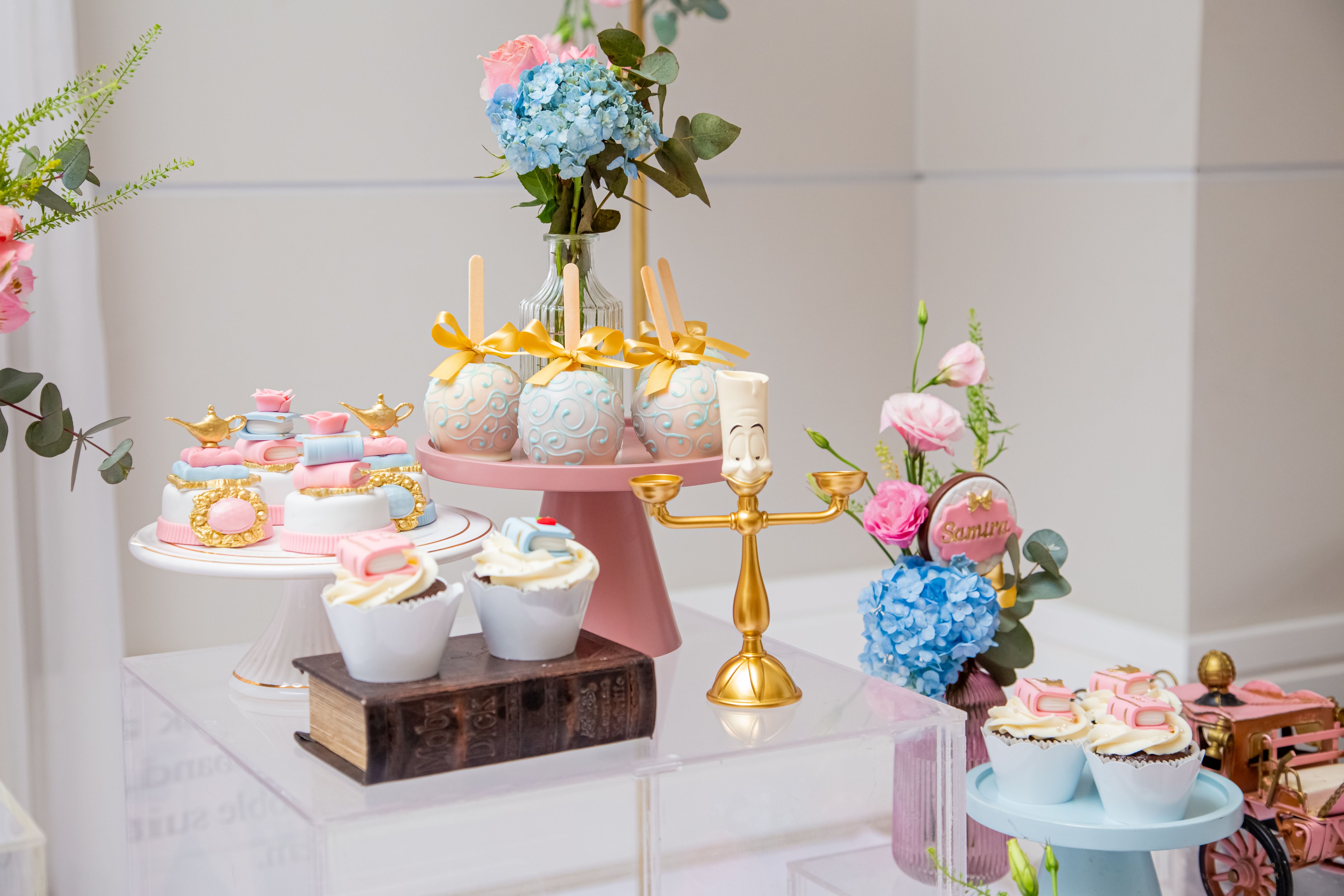 Elegant Dessert Table with Floral Decor and Candles · Free Stock Photo