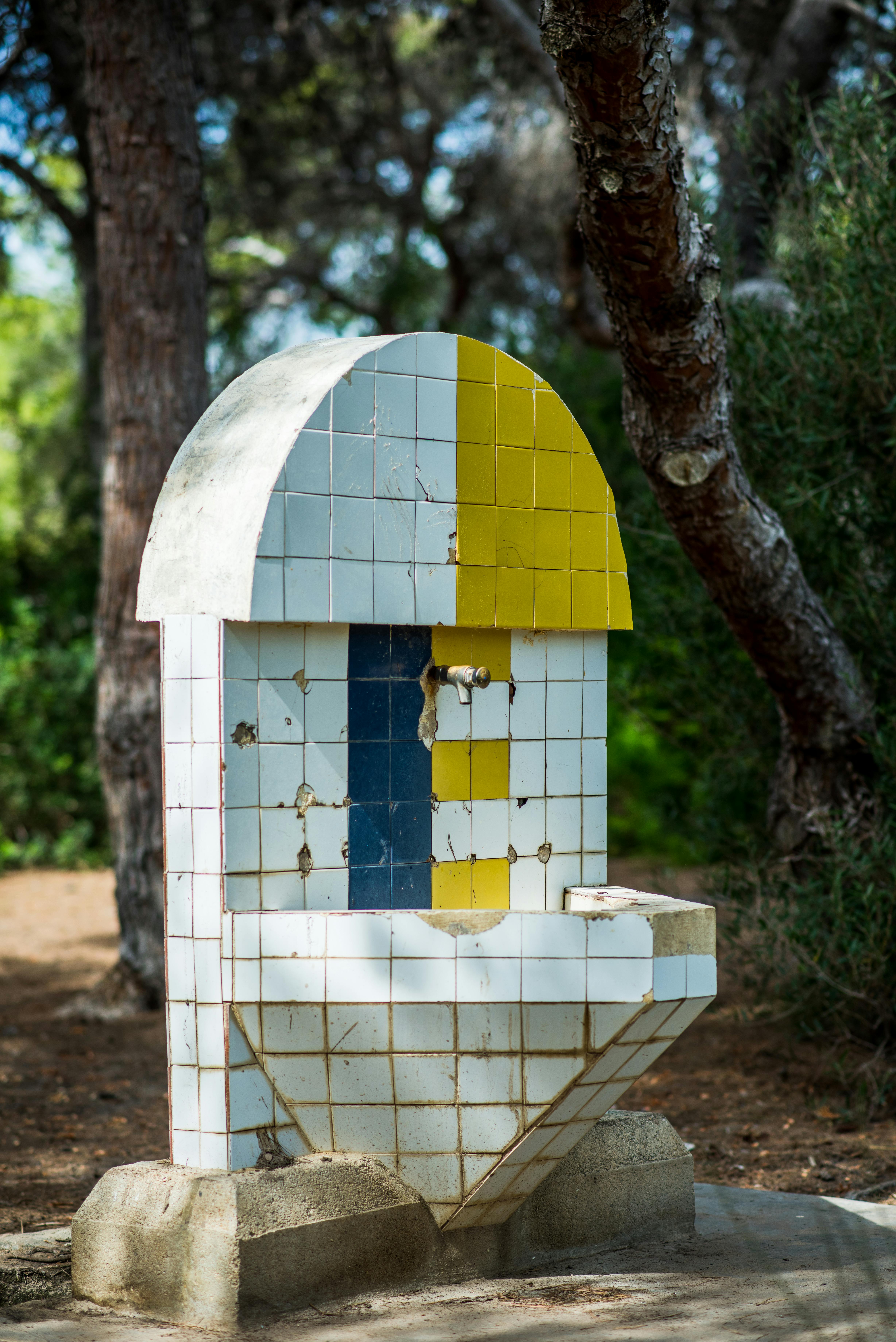 Mosaic Tile Structure in a Forest Setting · Free Stock Photo