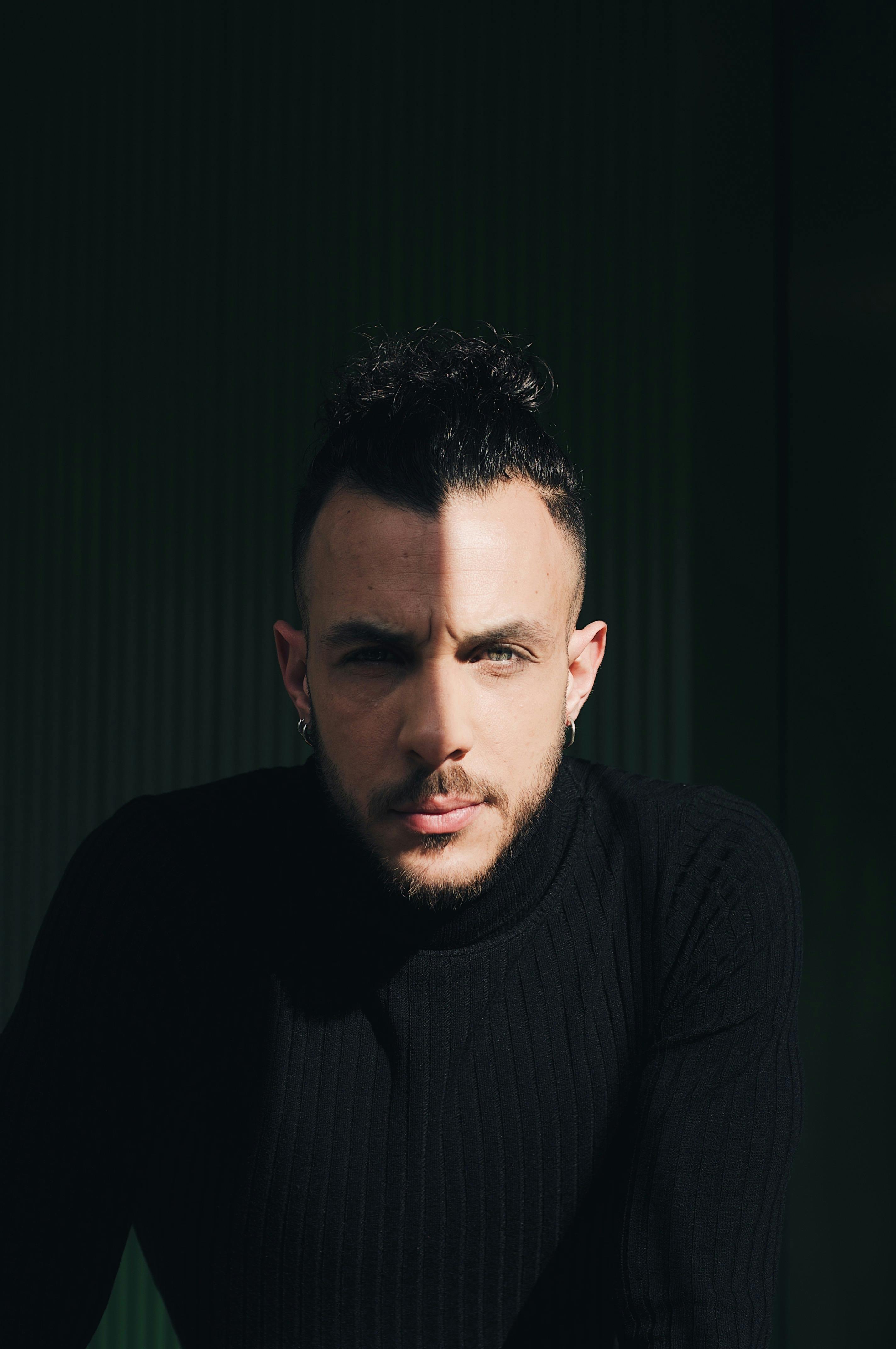 Dramatic Portrait of a Man in Half Shadow · Free Stock Photo