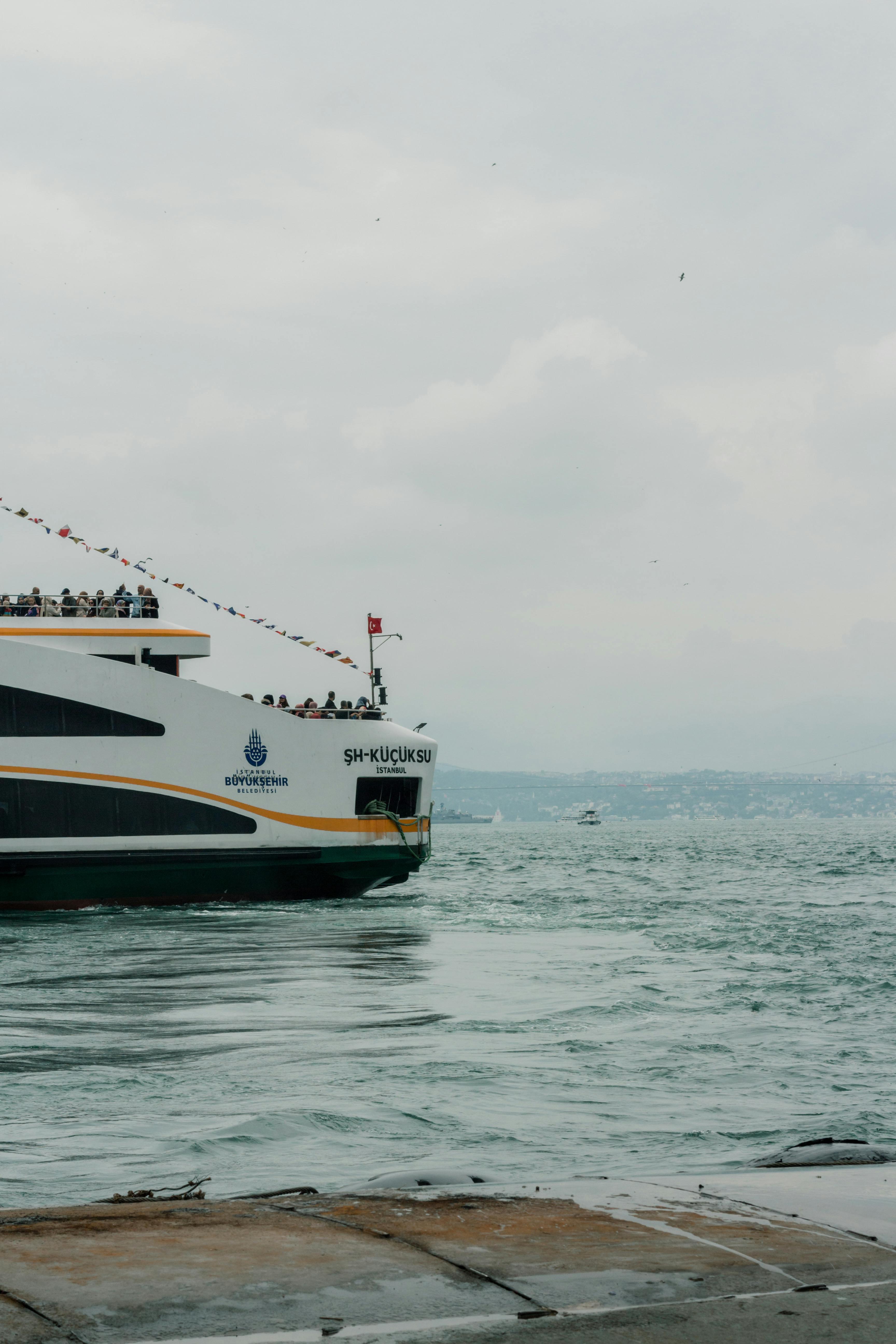 Modern Ferry on Scenic Waterway with Passengers · Free Stock Photo