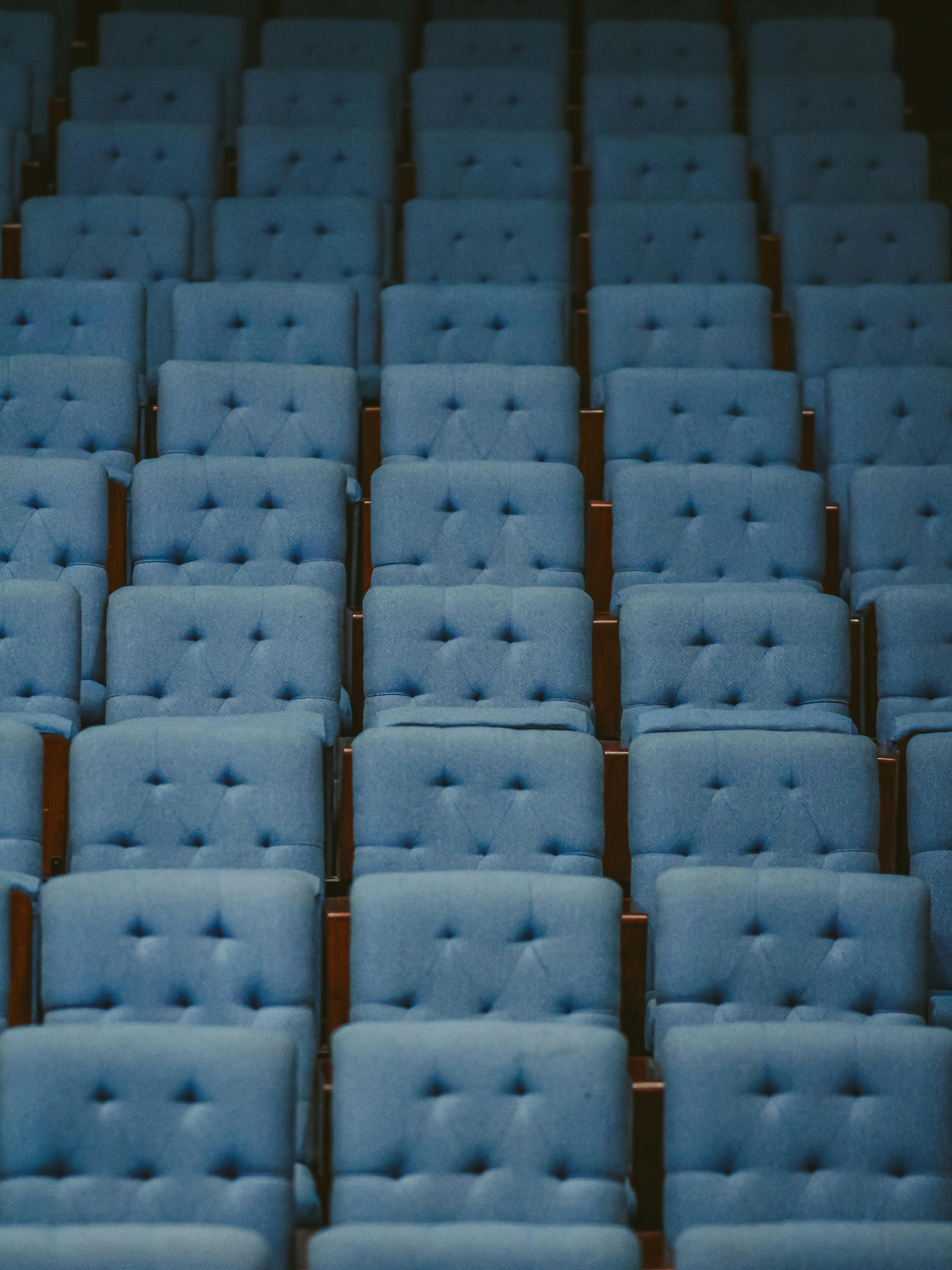 Symmetrical Blue Auditorium Chairs in Indoor Venue · Free Stock Photo