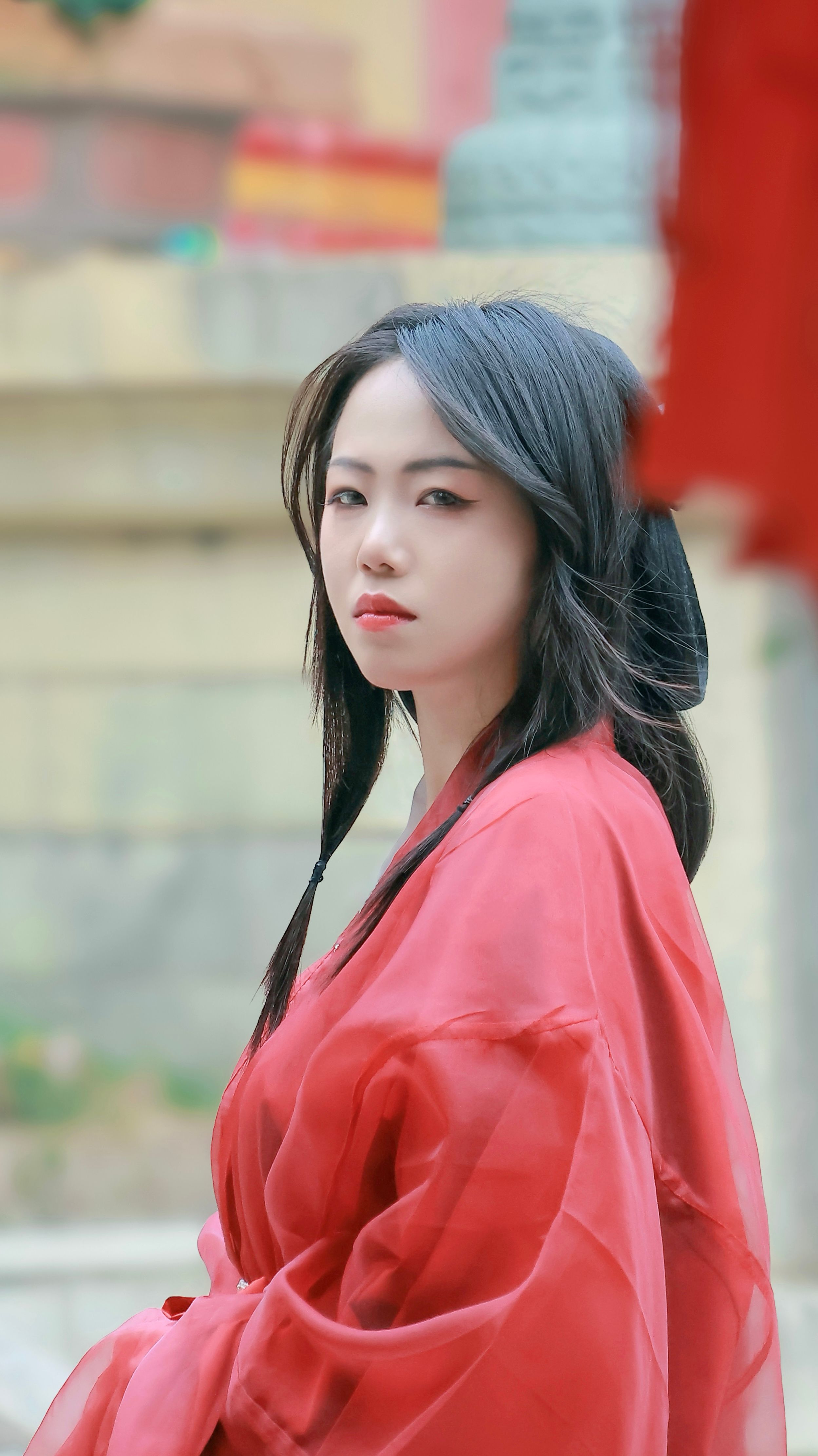 Elegantly Draped Woman in Red Pose Outdoors · Free Stock Photo