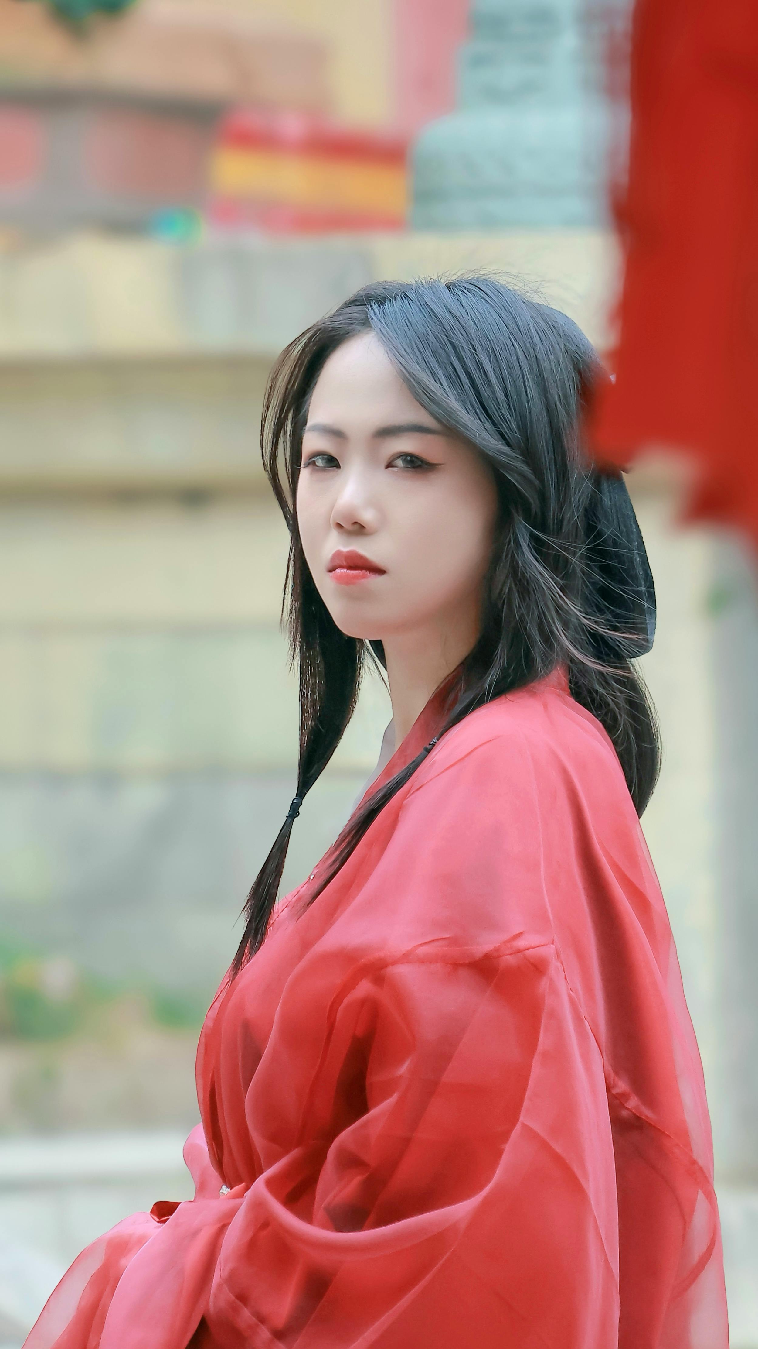 Elegantly Draped Woman in Red Pose Outdoors · Free Stock Photo