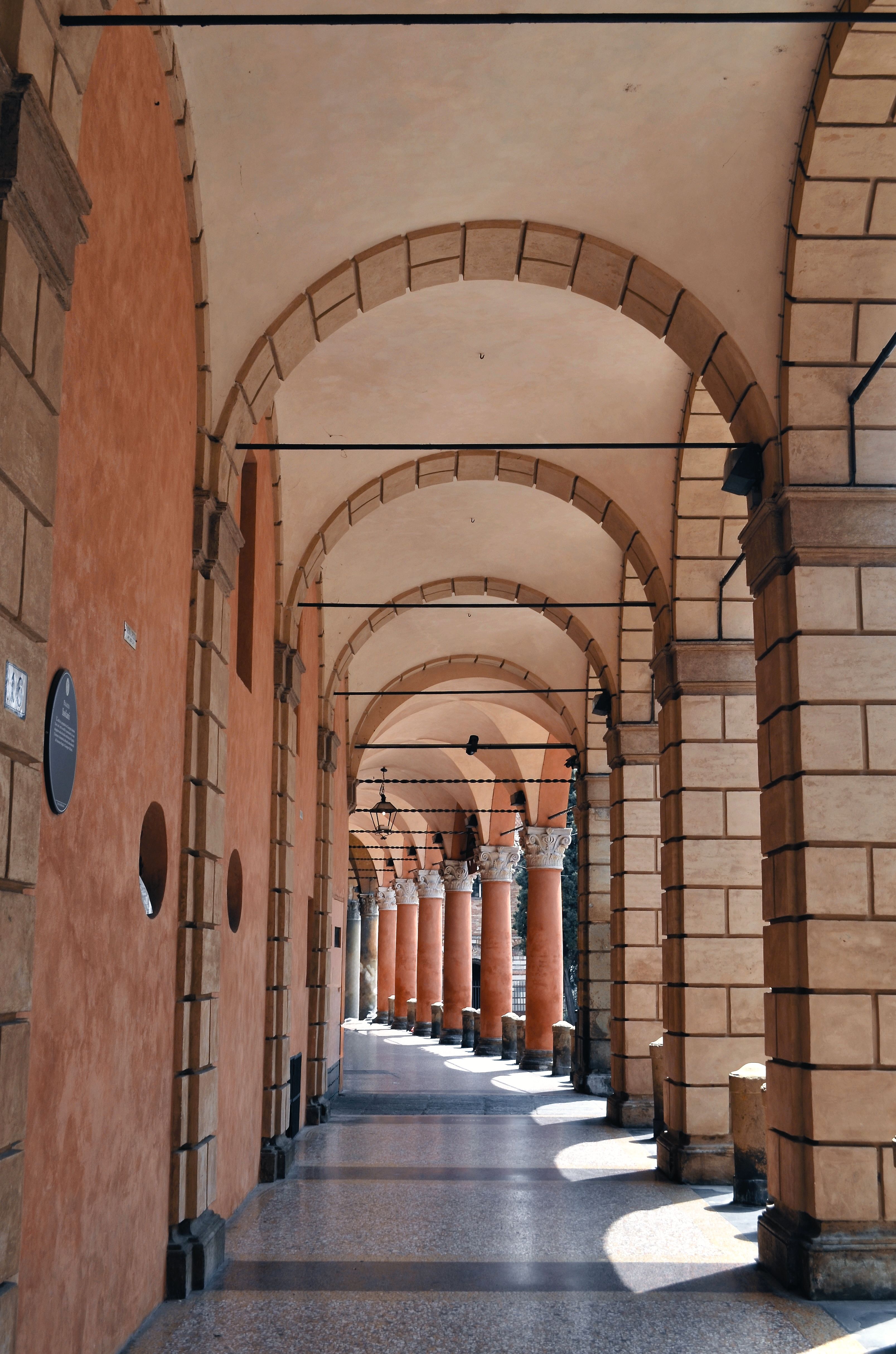 Bologna's Iconic Archways in Sunlight · Free Stock Photo