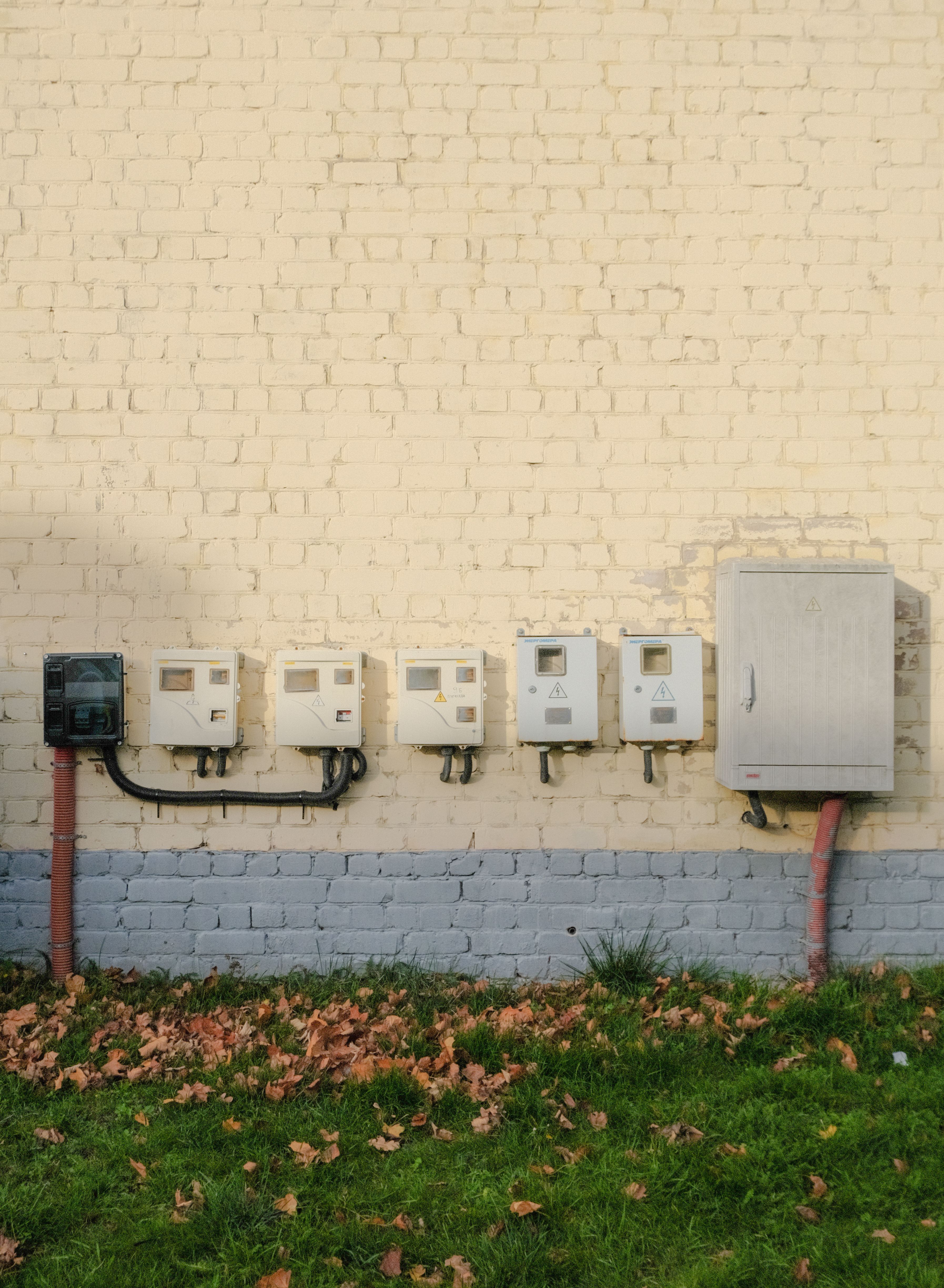 Electric Meters on Brick Wall in Kaliningrad · Free Stock Photo