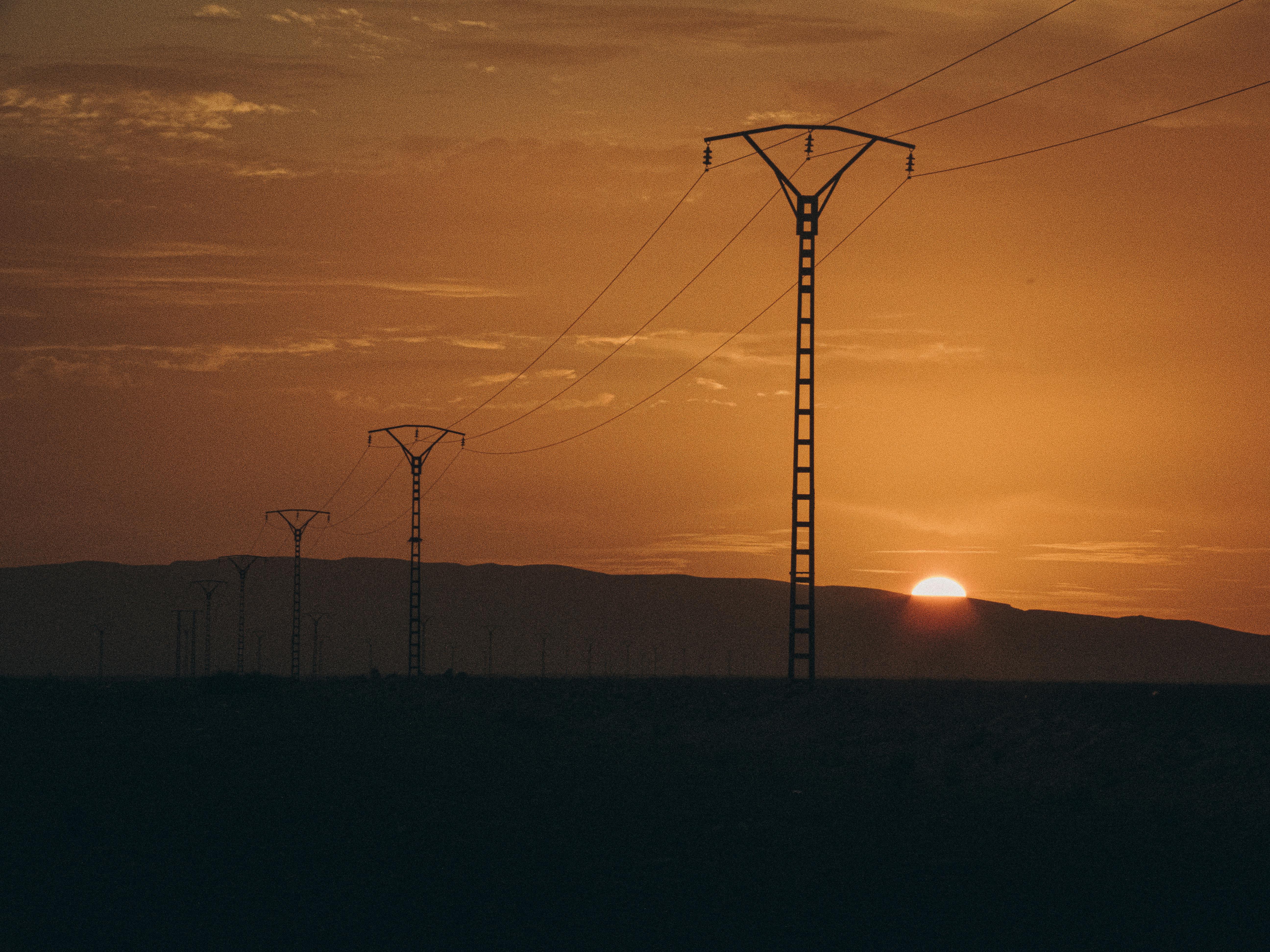Sunset Over Power Lines in Algerian Landscape · Free Stock Photo