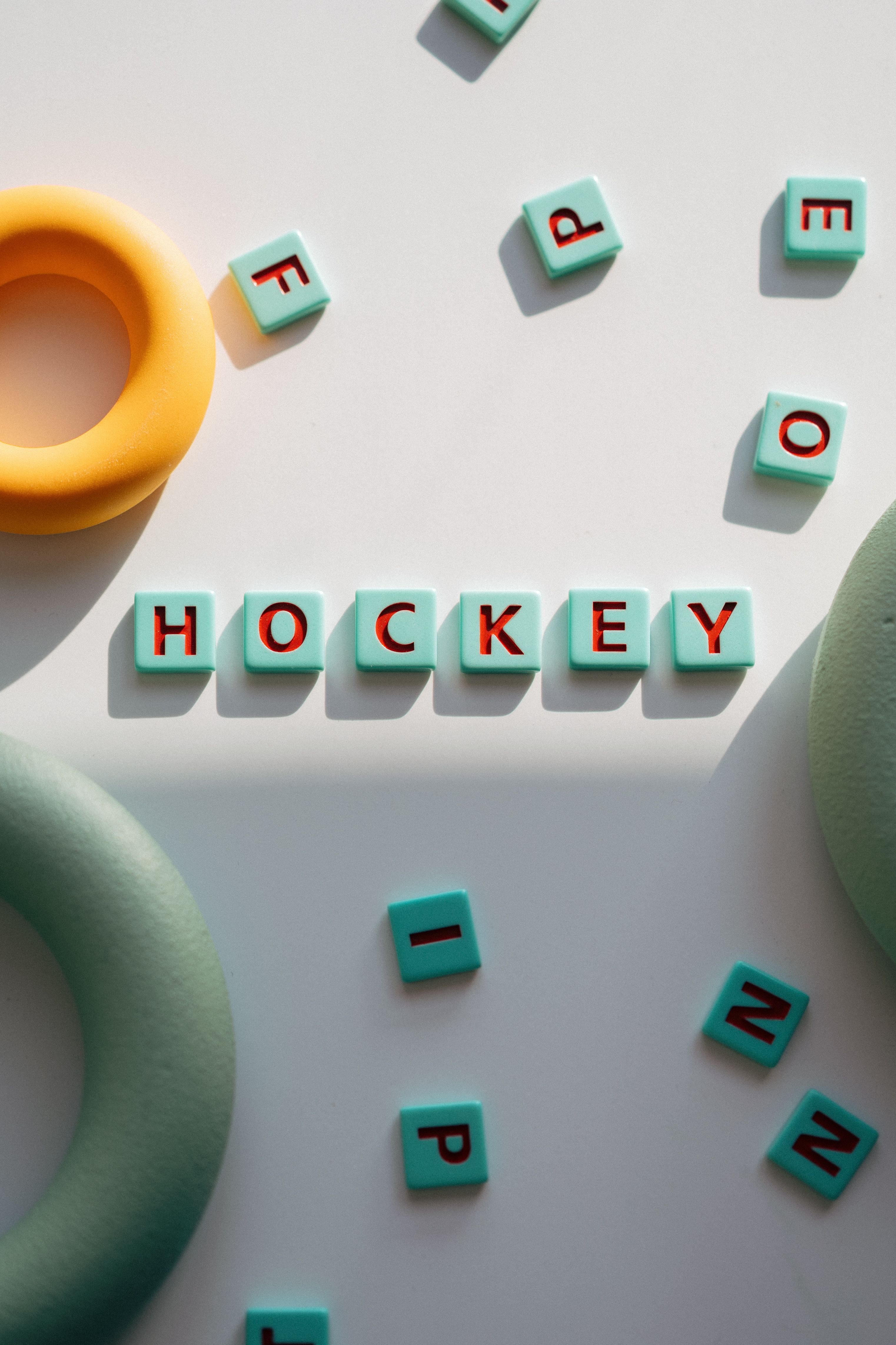 Colorful Letter Tiles Arranged in Flat Lay Design · Free Stock Photo