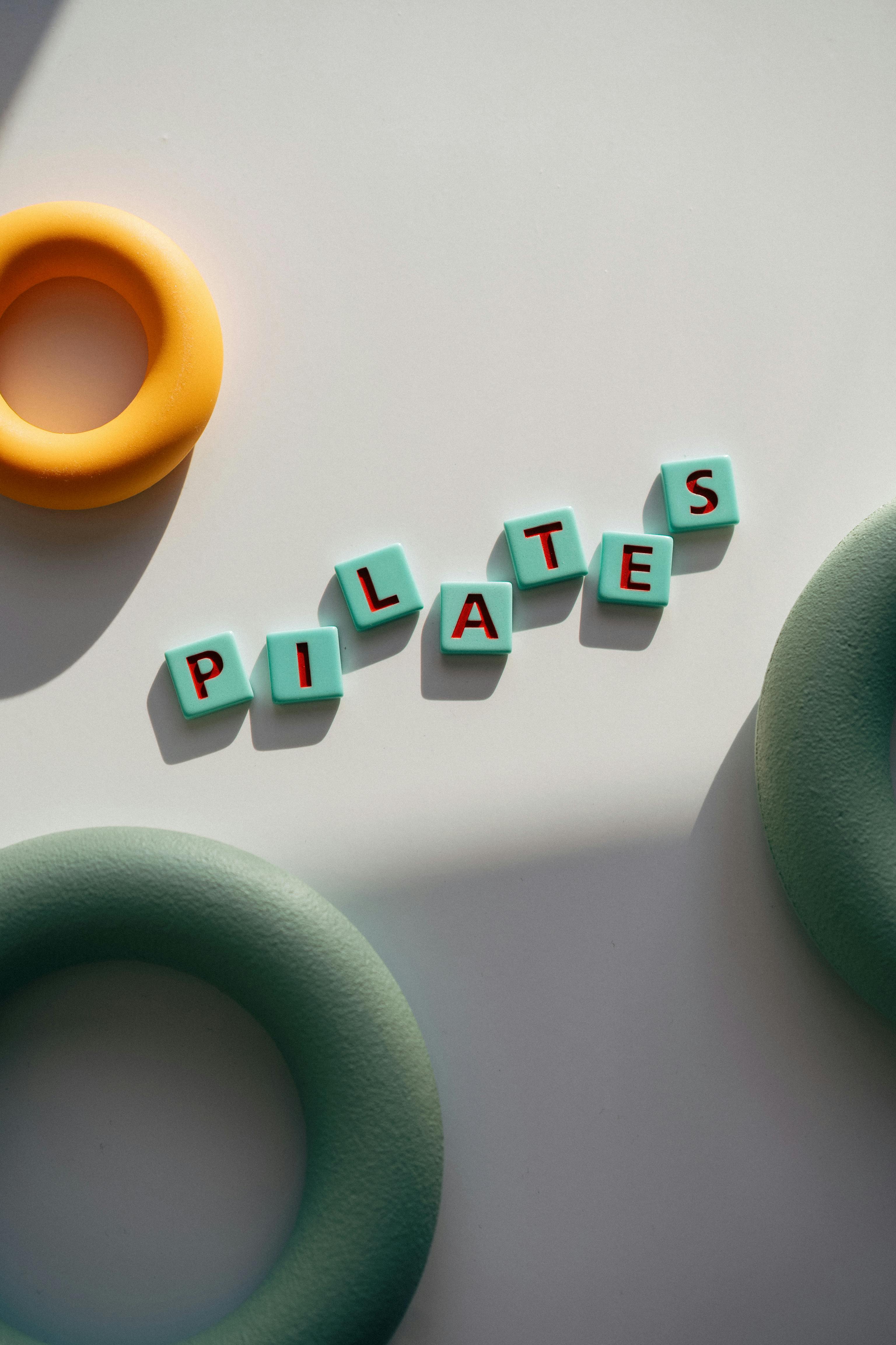 Colorful Pilates-themed Exercise Equipment Layout · Free Stock Photo