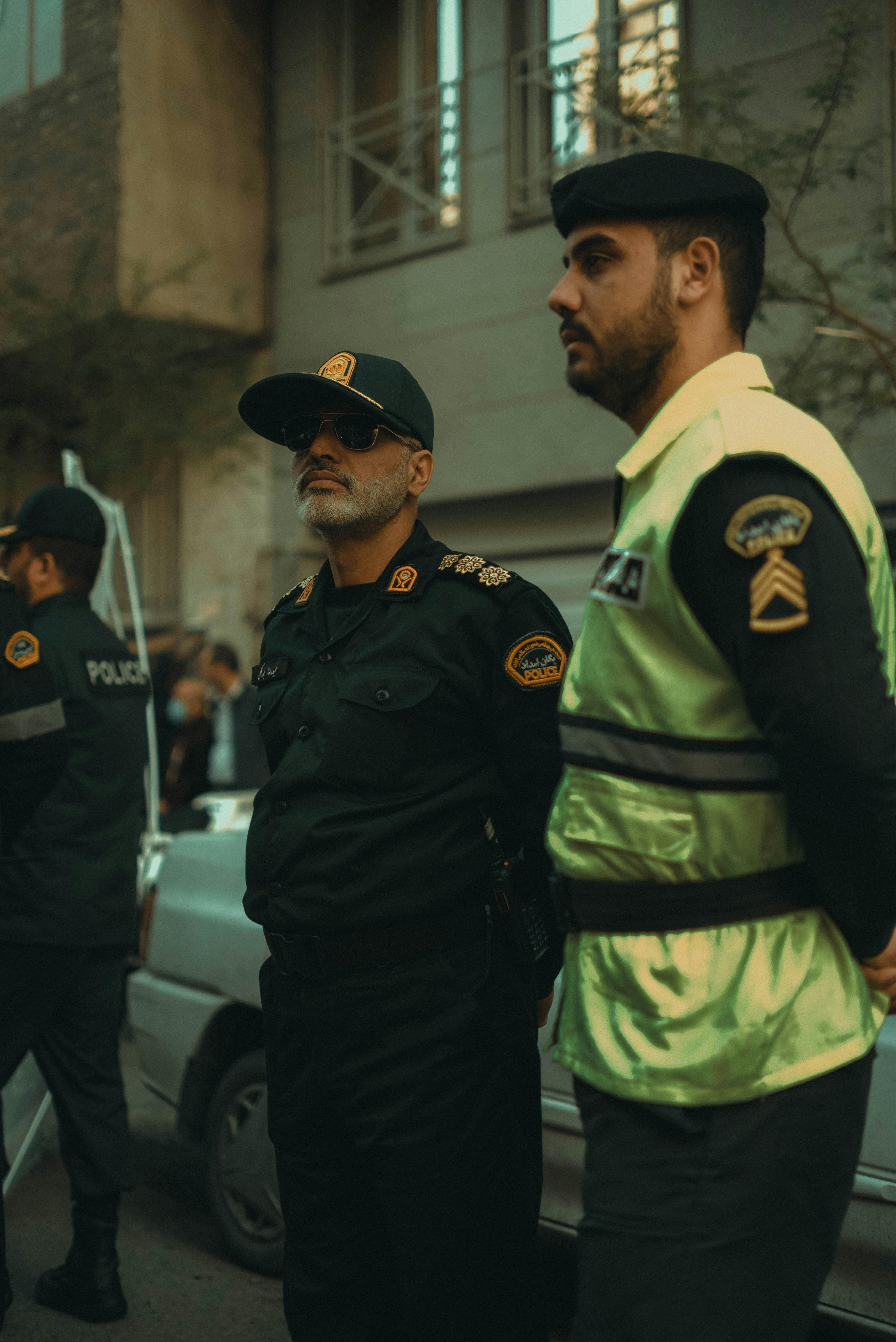 Iranian Police Officers on Duty Outdoors · Free Stock Photo