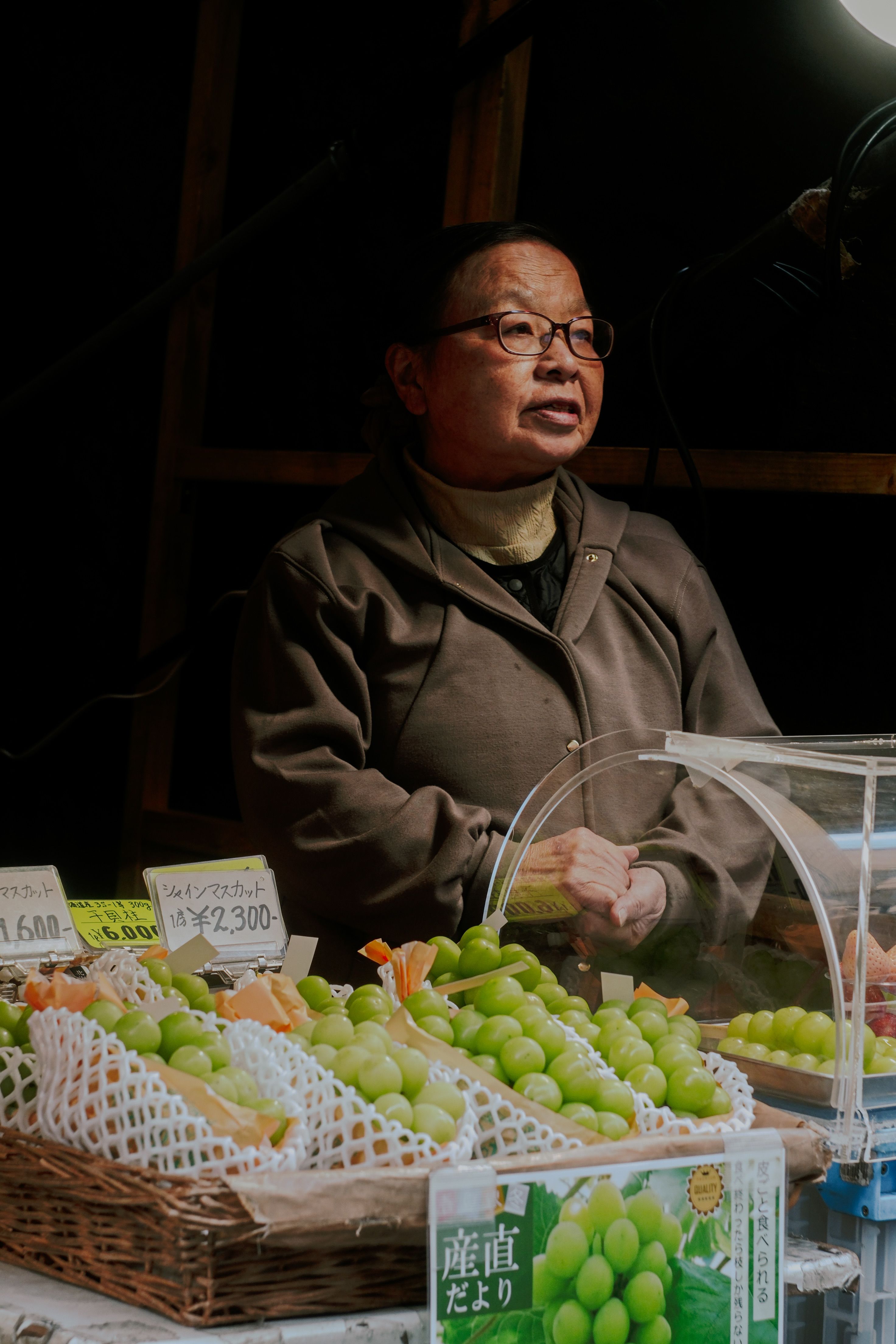Street Vendor Selling Fresh Grapes in Tokyo · Free Stock Photo