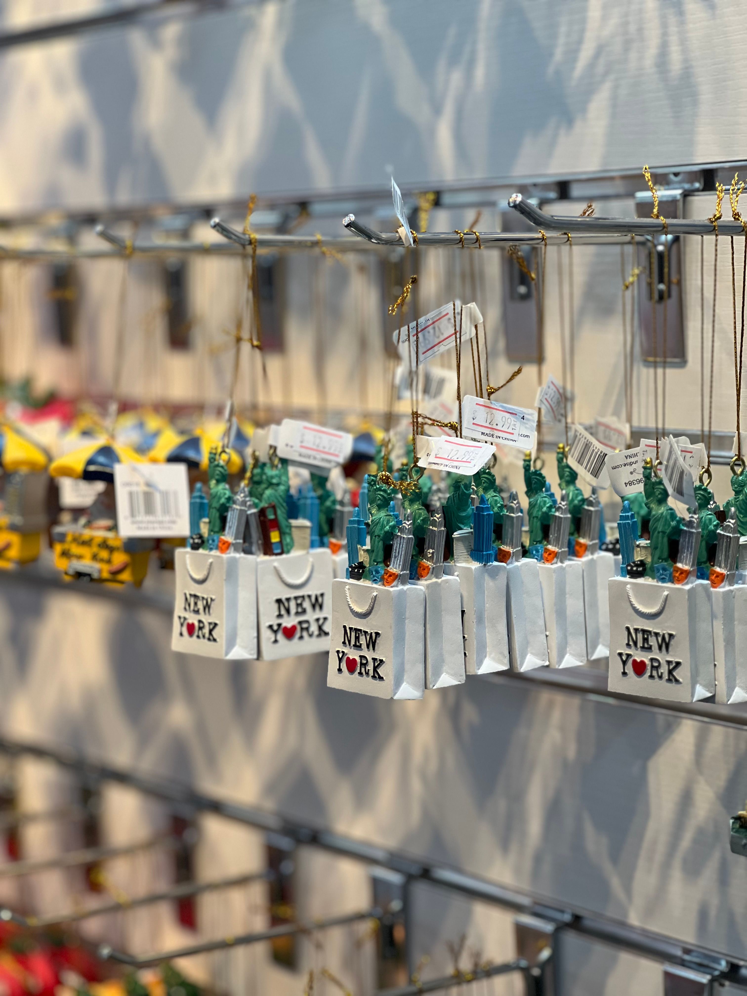Hanging New York Souvenir Ornaments in Shop Display · Free Stock Photo