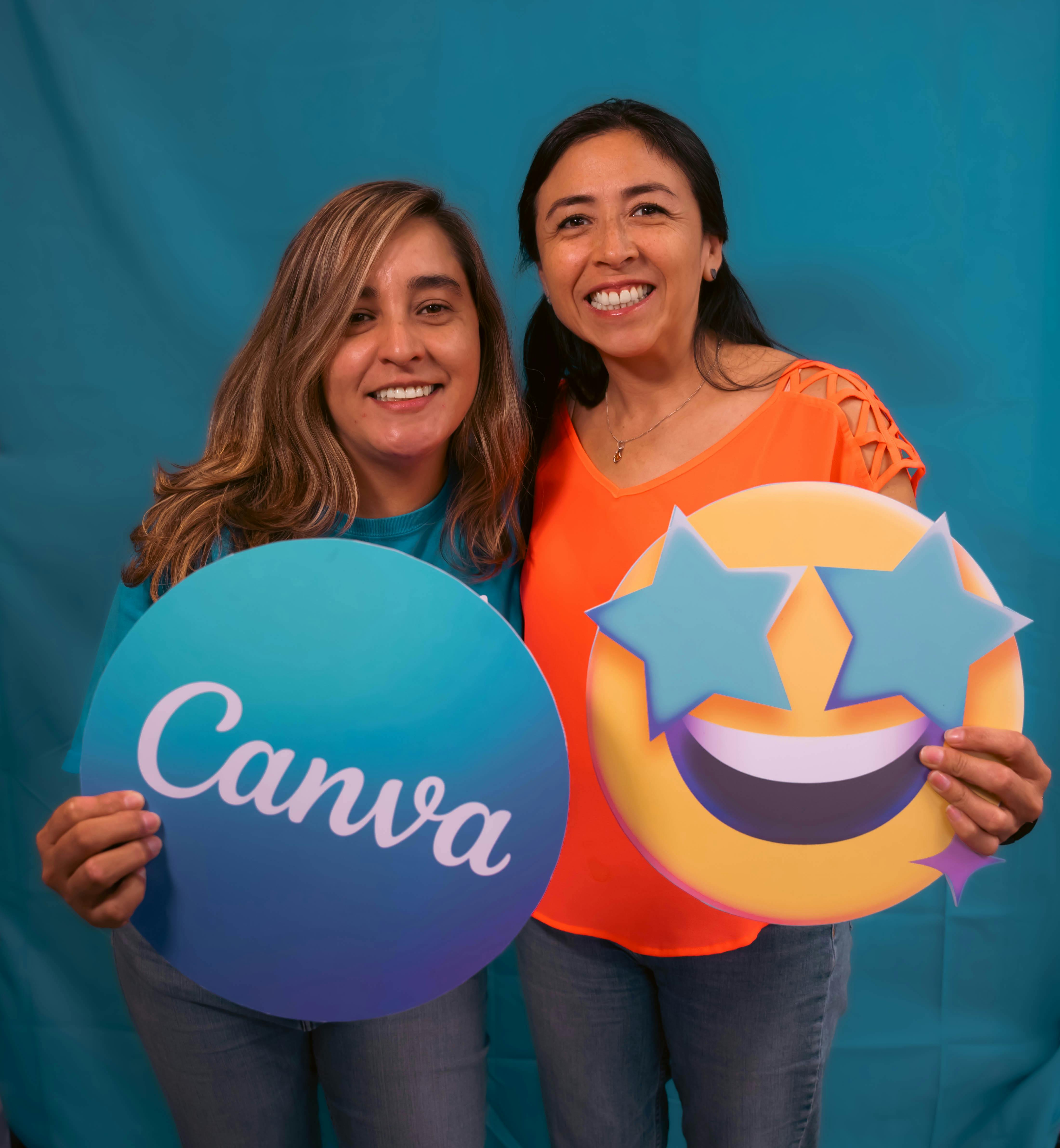 Women Smiling with Canva and Emoji Signs · Free Stock Photo