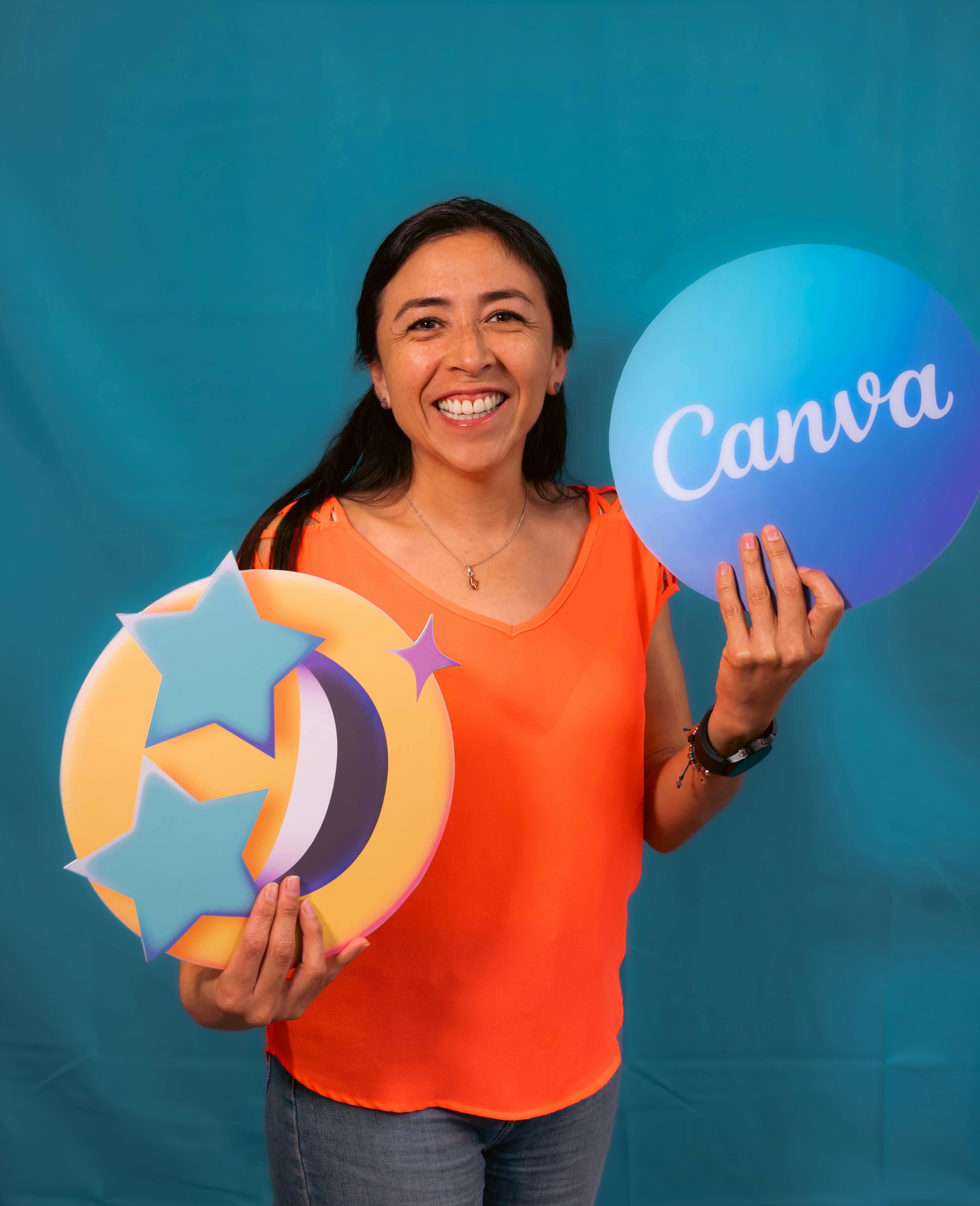 Smiling Woman Holding Canva and Star Signs · Free Stock Photo