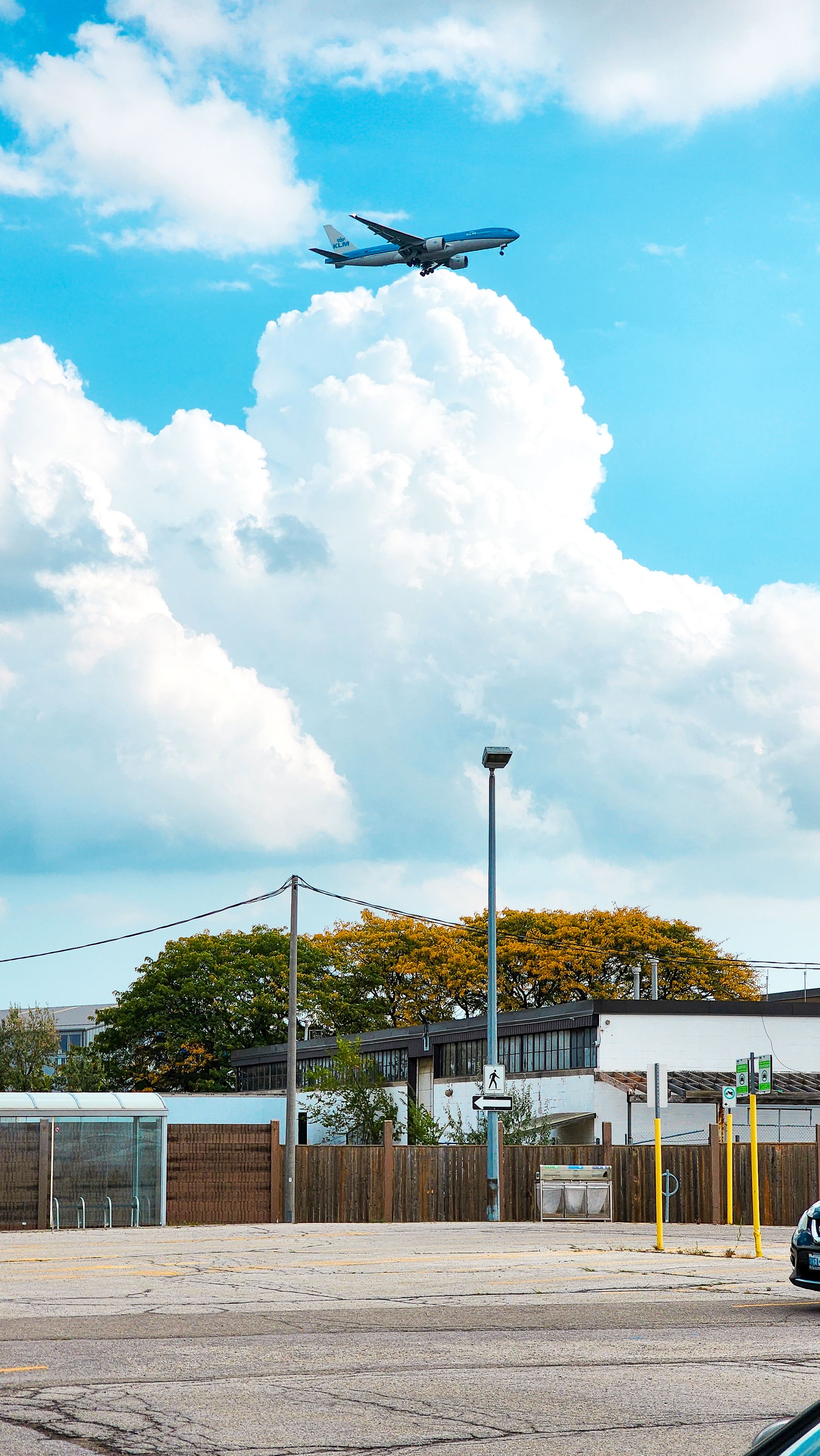 Airplane Soaring Over Toronto Neighborhood Skyline · Free Stock Photo