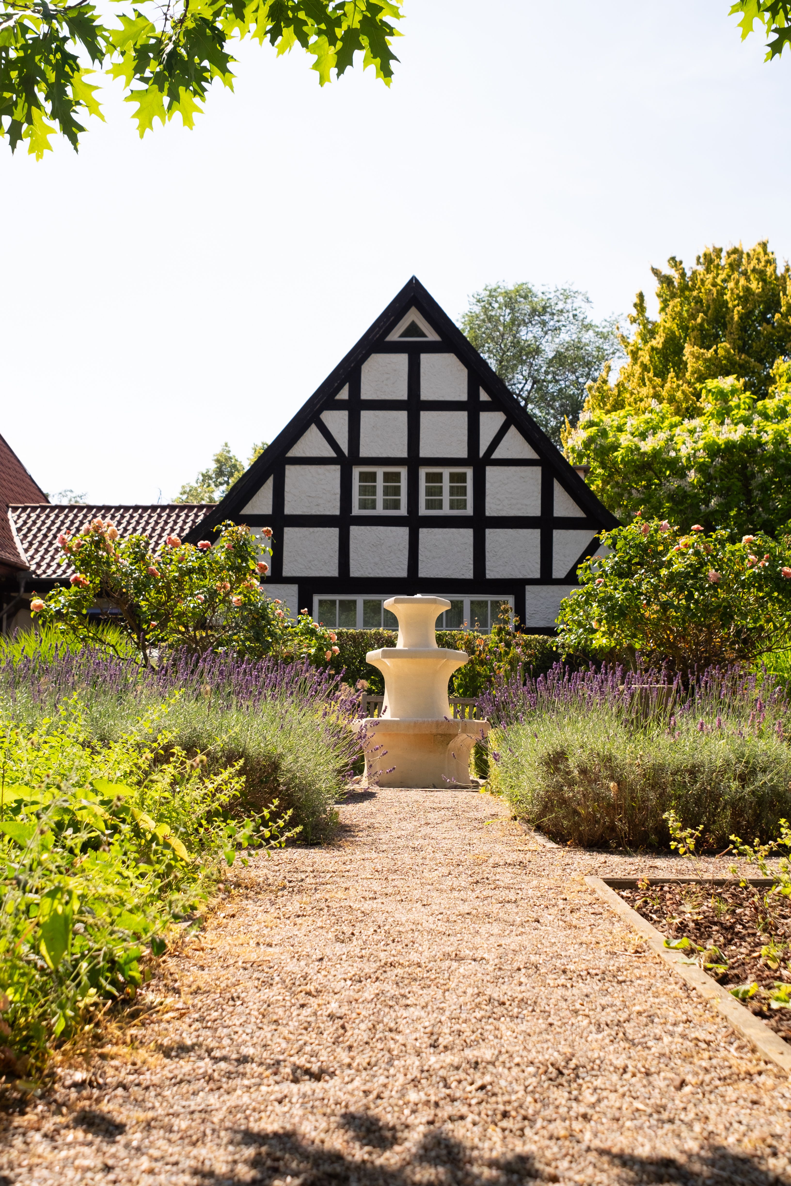 Charming European Garden with Half-Timbered House · Free Stock Photo