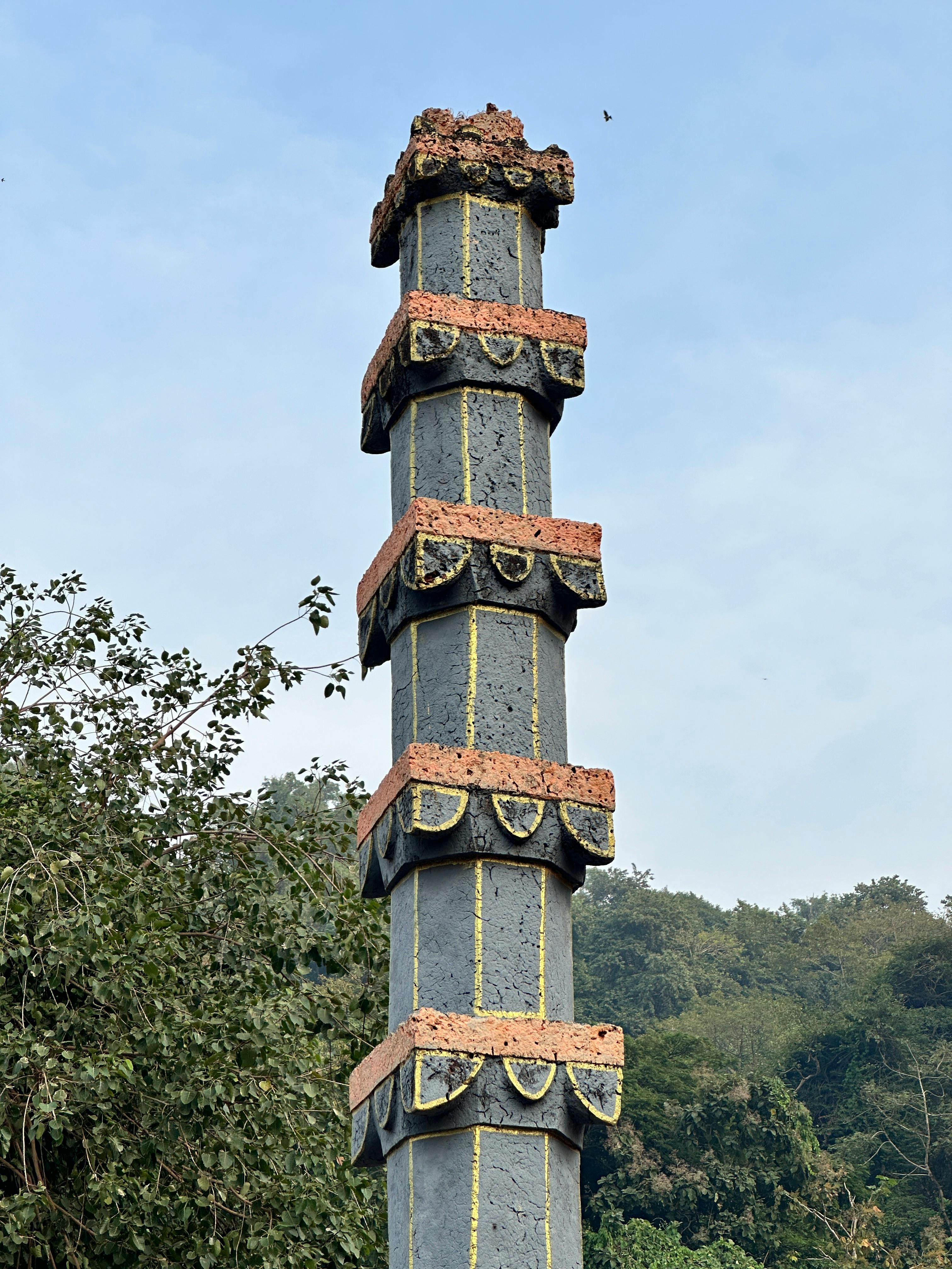 Decorative Stone Pillar in Natural Setting · Free Stock Photo