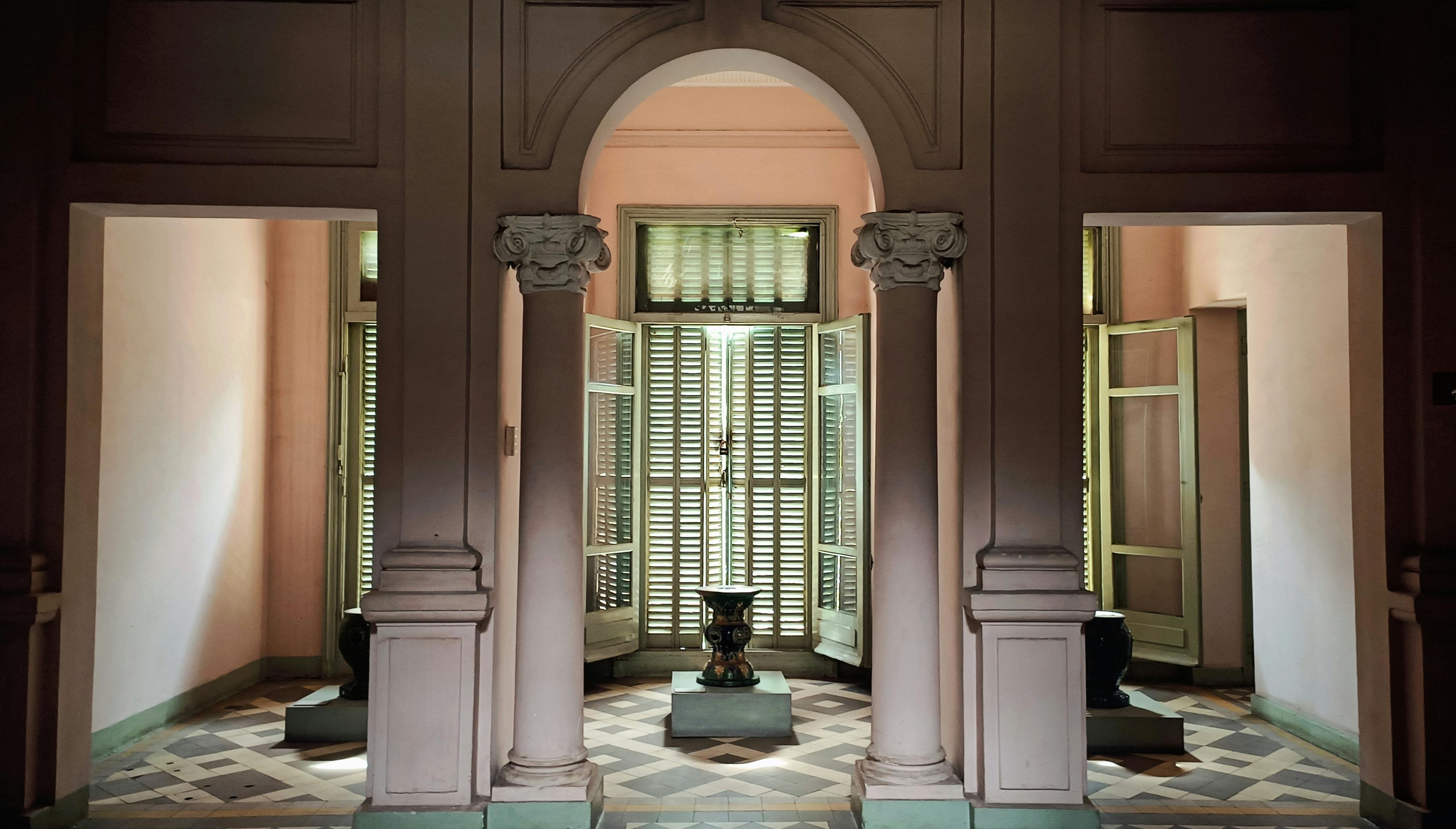Elegant Interior with Classical Columns and Shutters · Free Stock Photo
