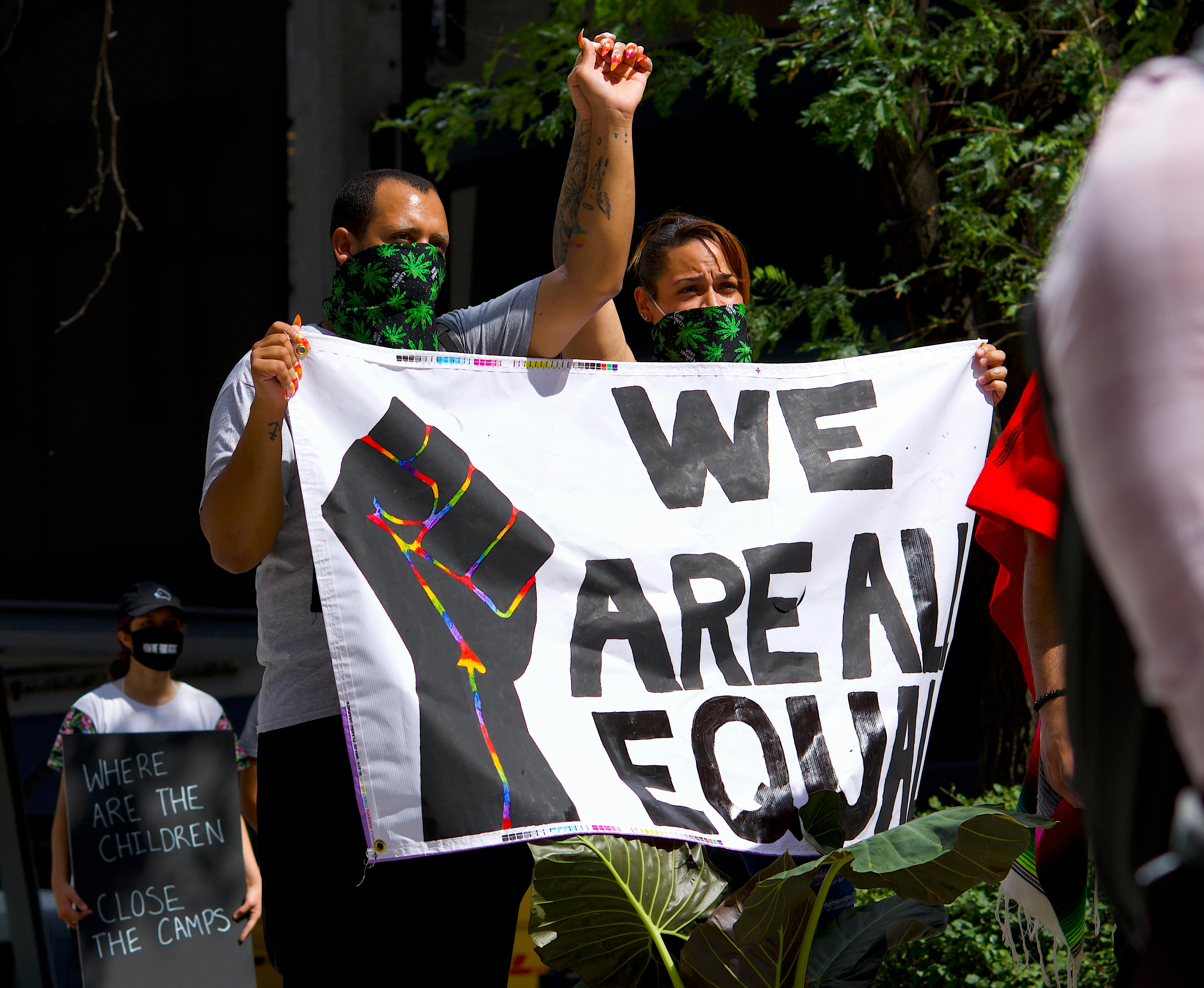 Protesters Holding 'We Are All Equal' Banner Outdoors · Free Stock Photo