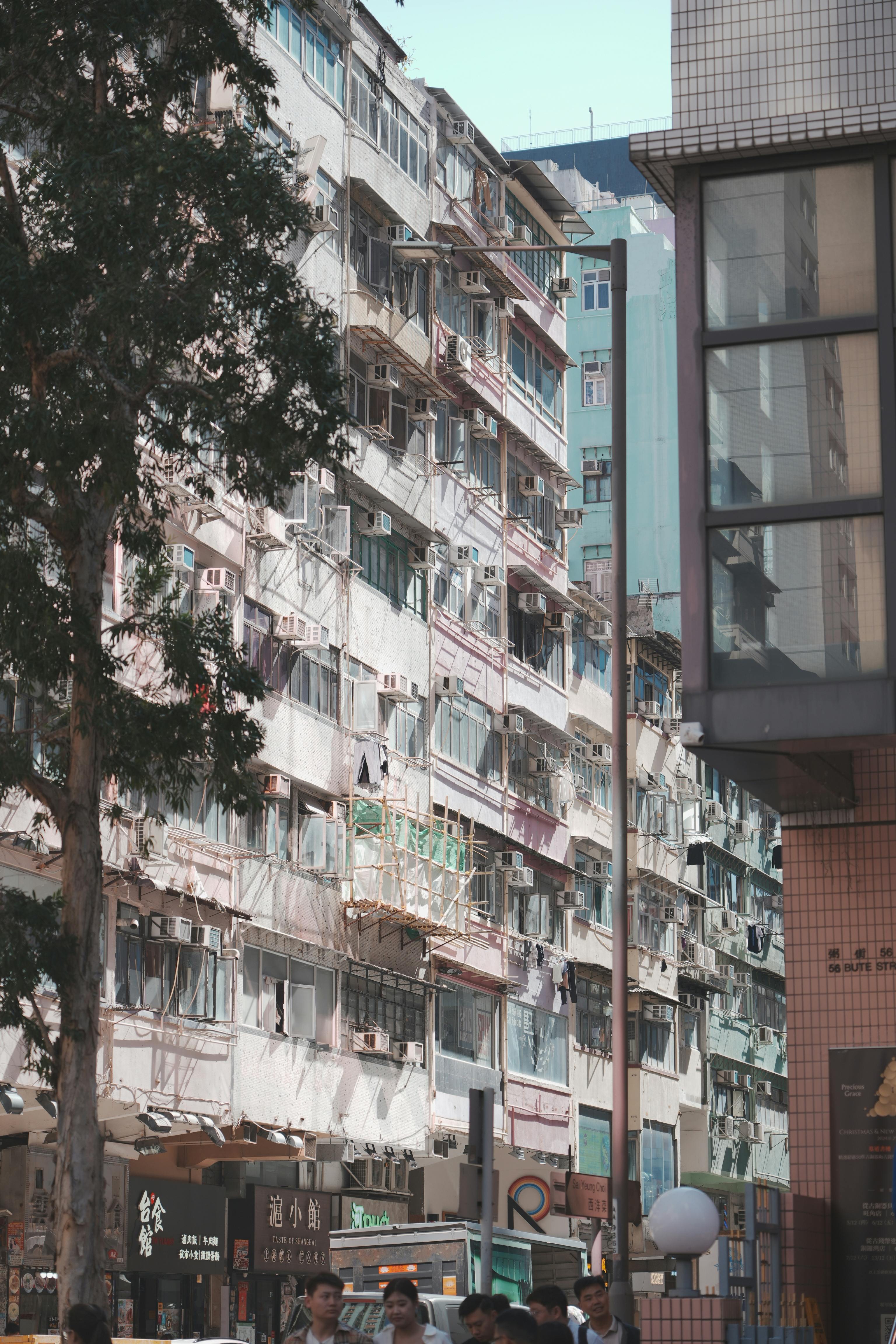 Busy Urban Street with Old Apartment Buildings · Free Stock Photo