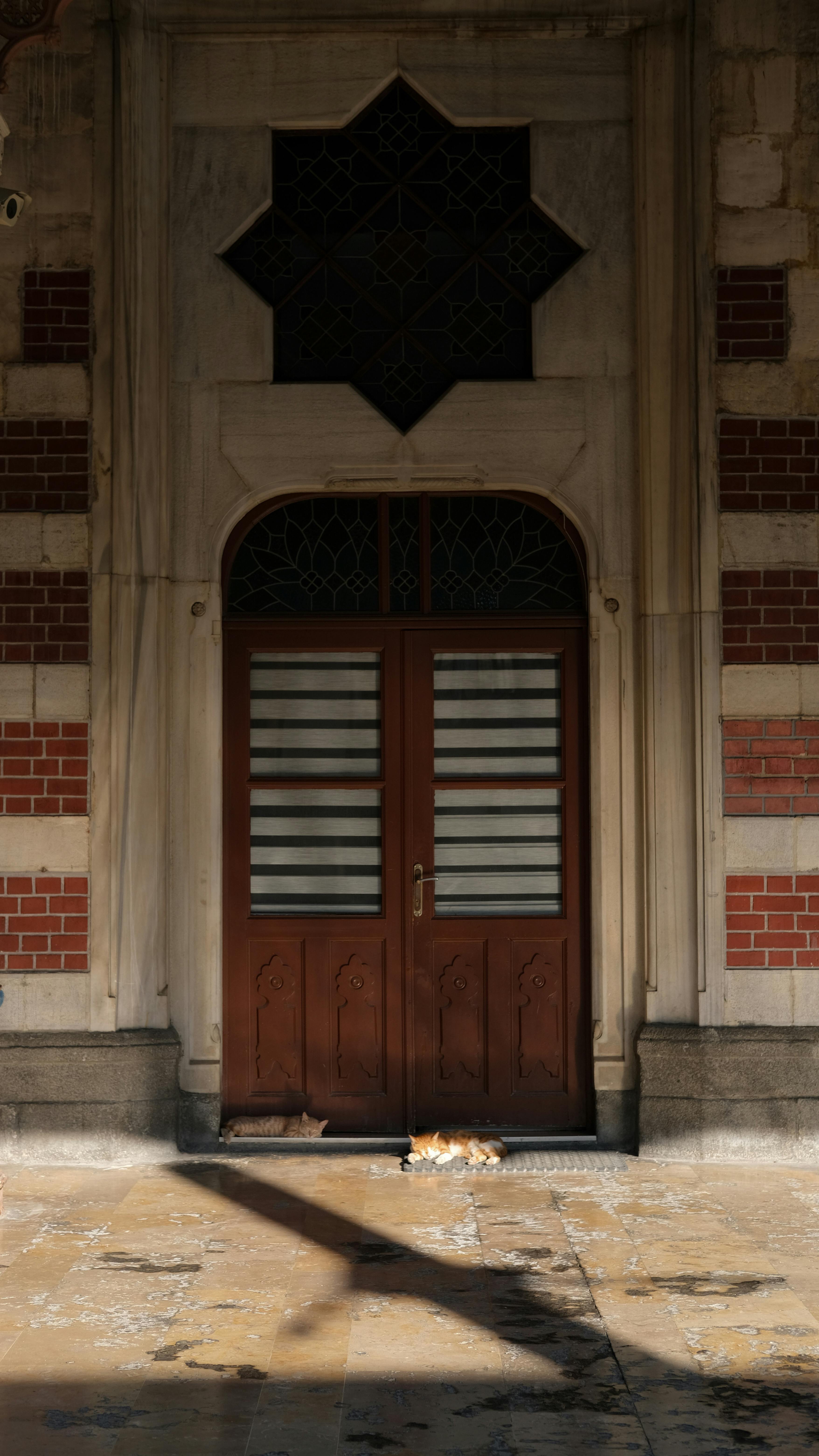 Historic Architectural Doorway with Sunlight and Shadow · Free Stock Photo