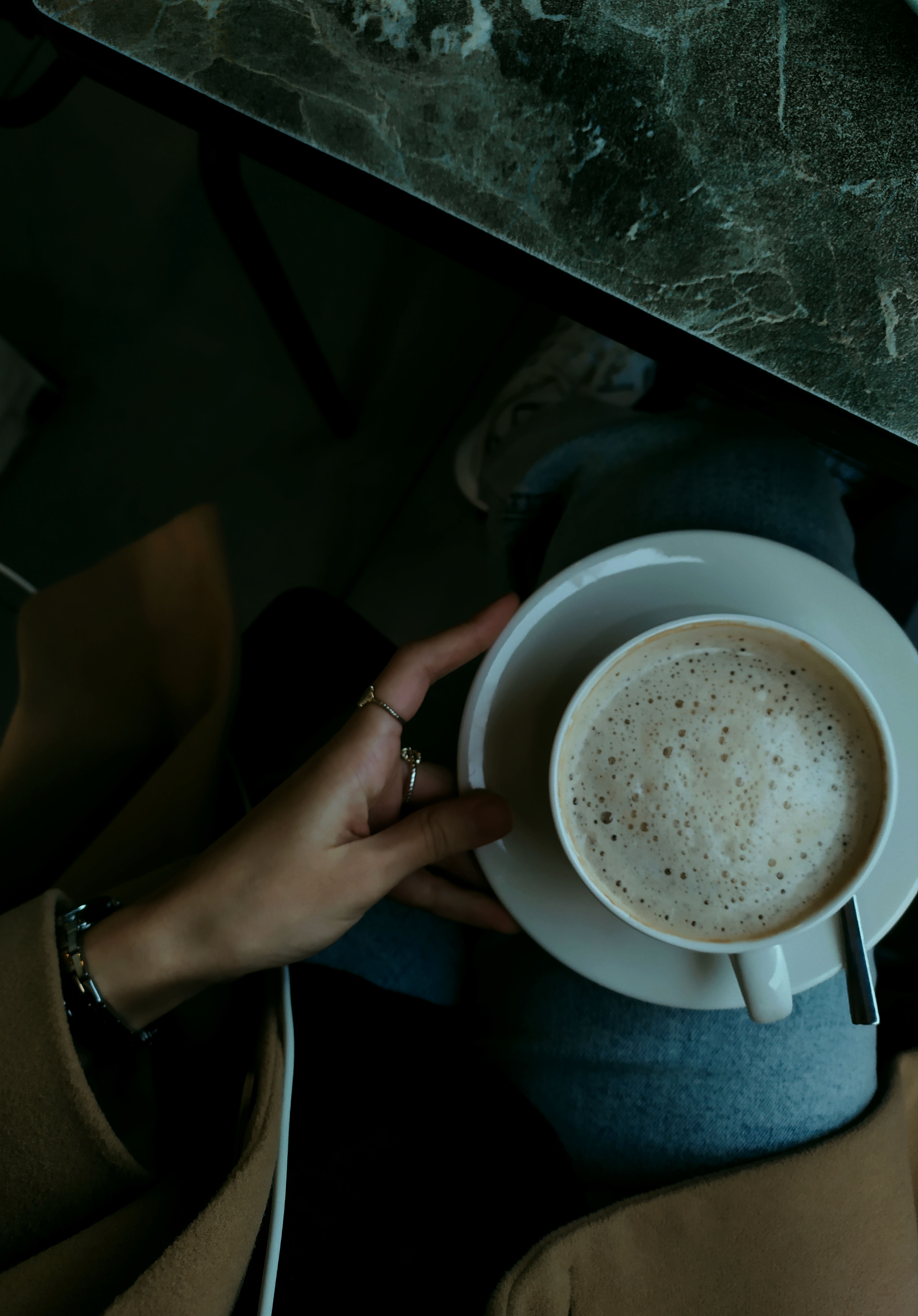 Cozy Coffee Moment with Cappuccino and Denim · Free Stock Photo