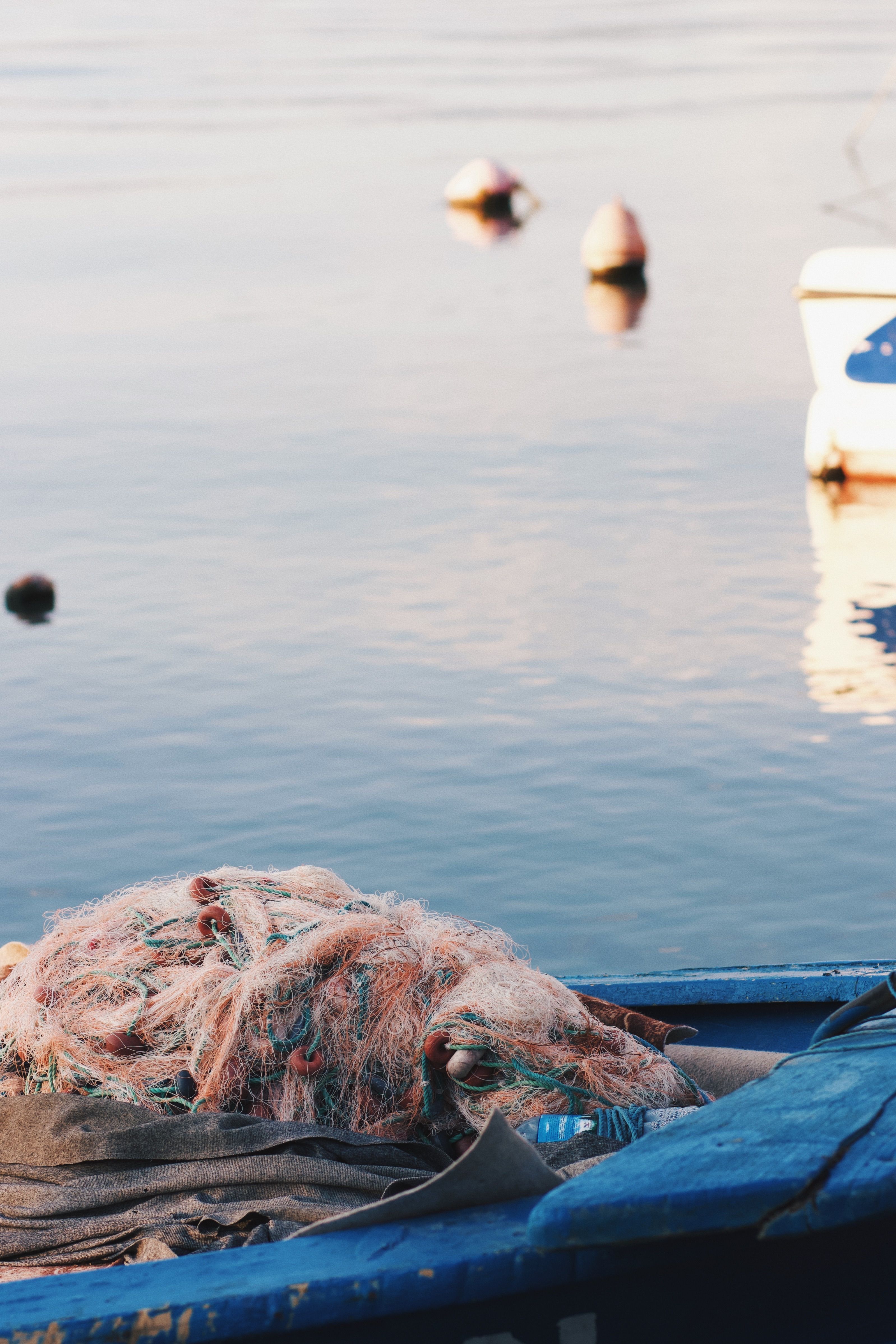 Serene Coastal Fishing Boat Scene at Sunrise · Free Stock Photo