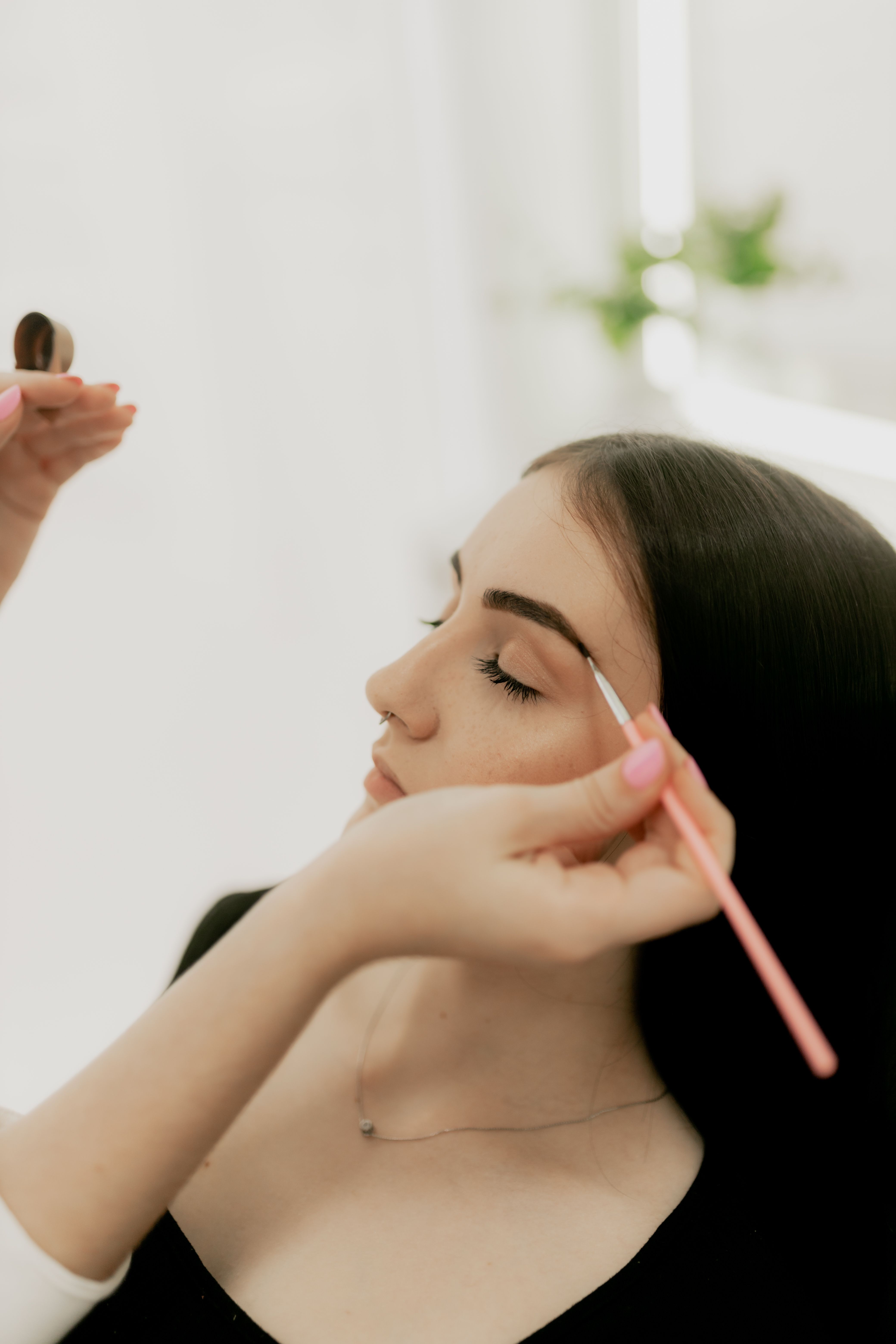 Close-up of Woman Receiving Eye Makeup Application · Free Stock Photo