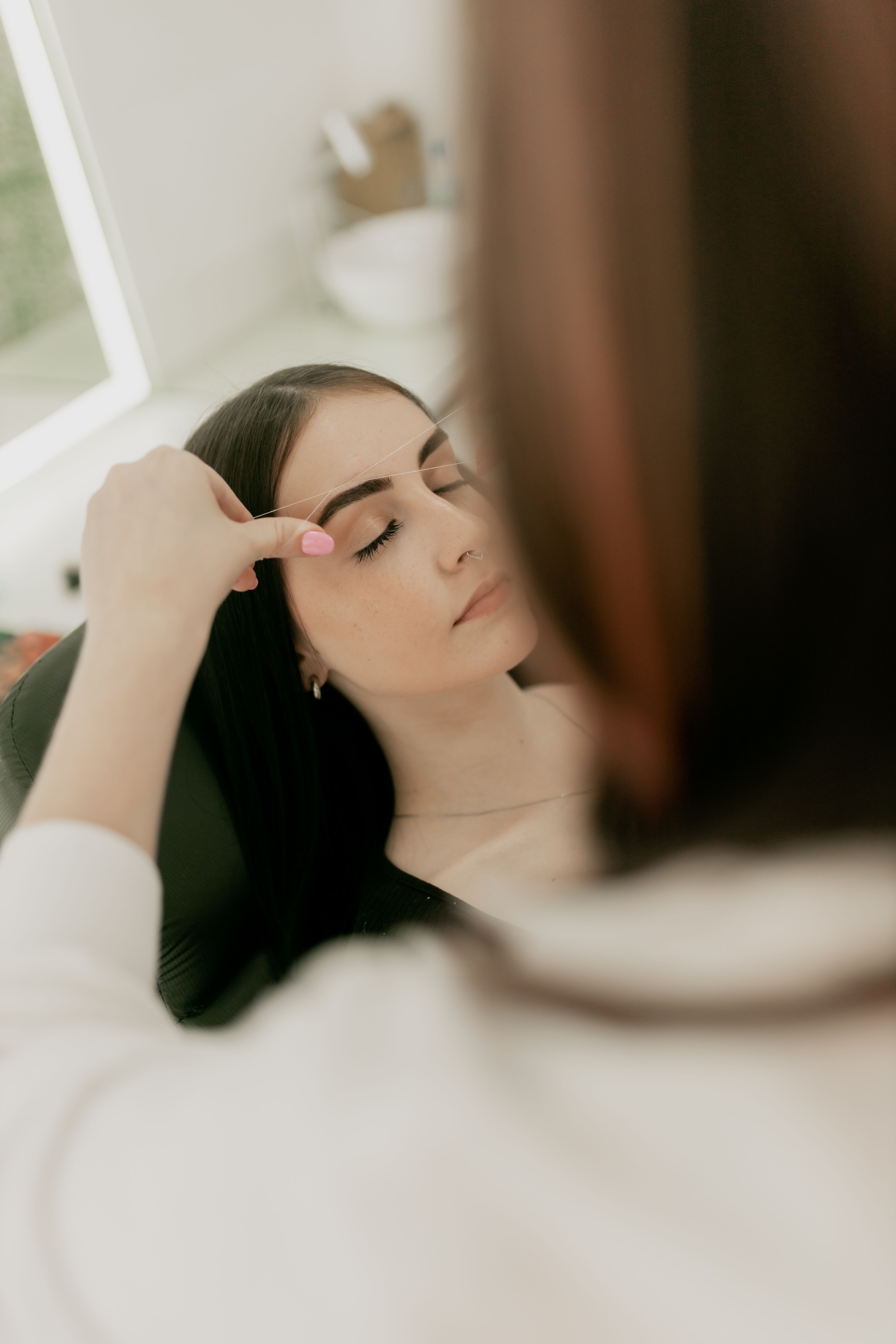 Professional Eyebrow Shaping At Beauty Salon Free Stock Photo
