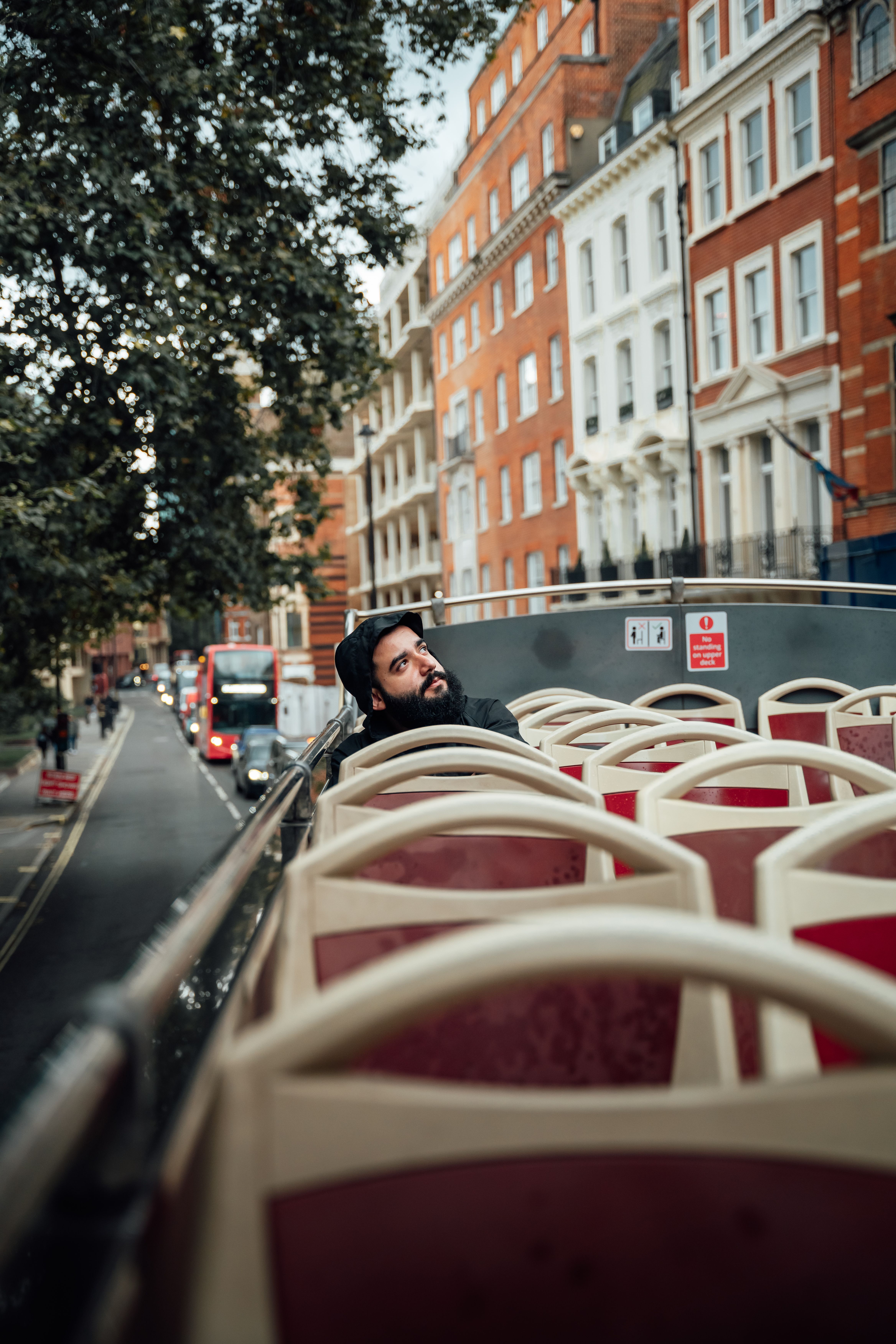 Man Enjoys View from Open-Top Bus in London · Free Stock Photo