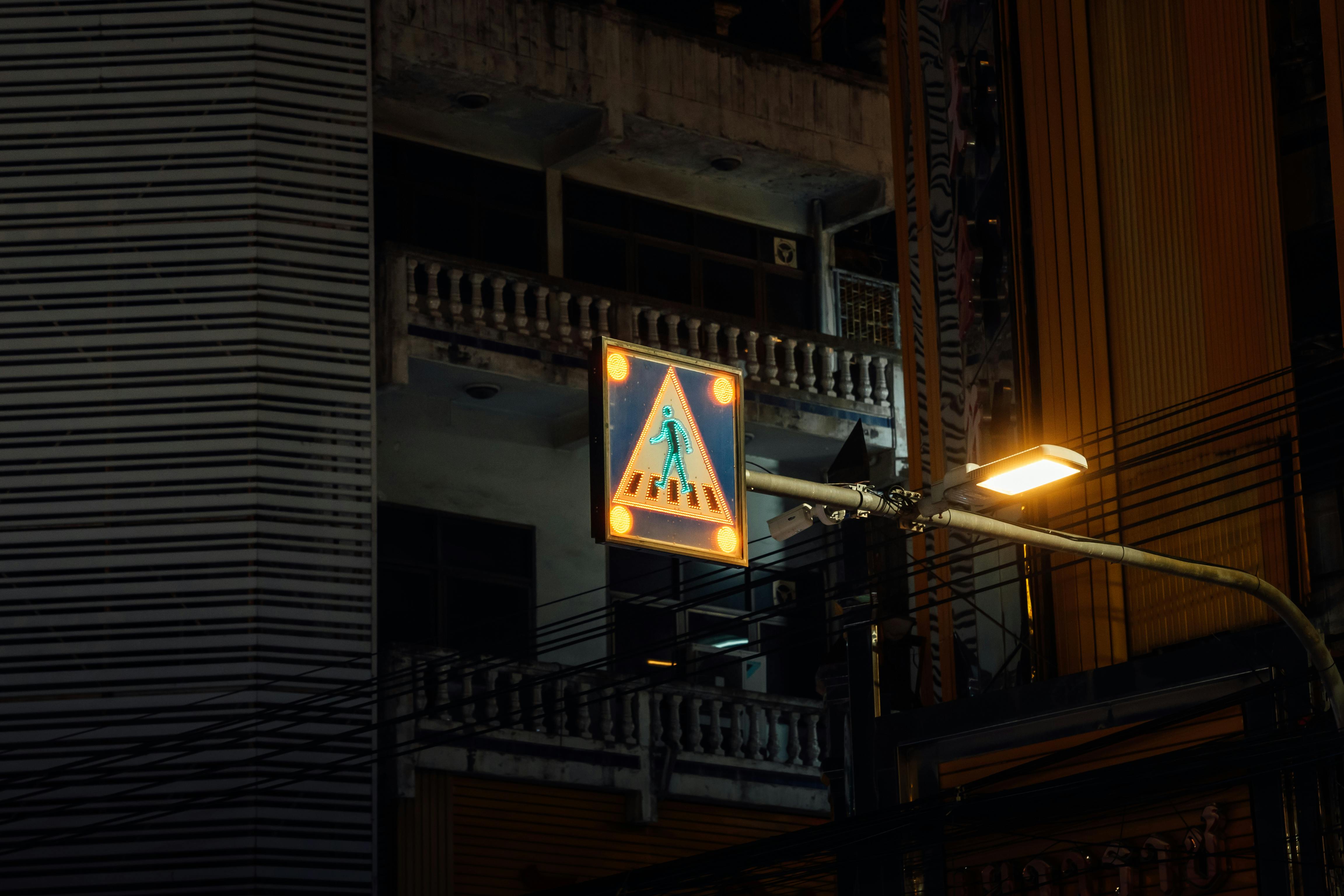 Illuminated Pedestrian Crossing Sign at Night · Free Stock Photo
