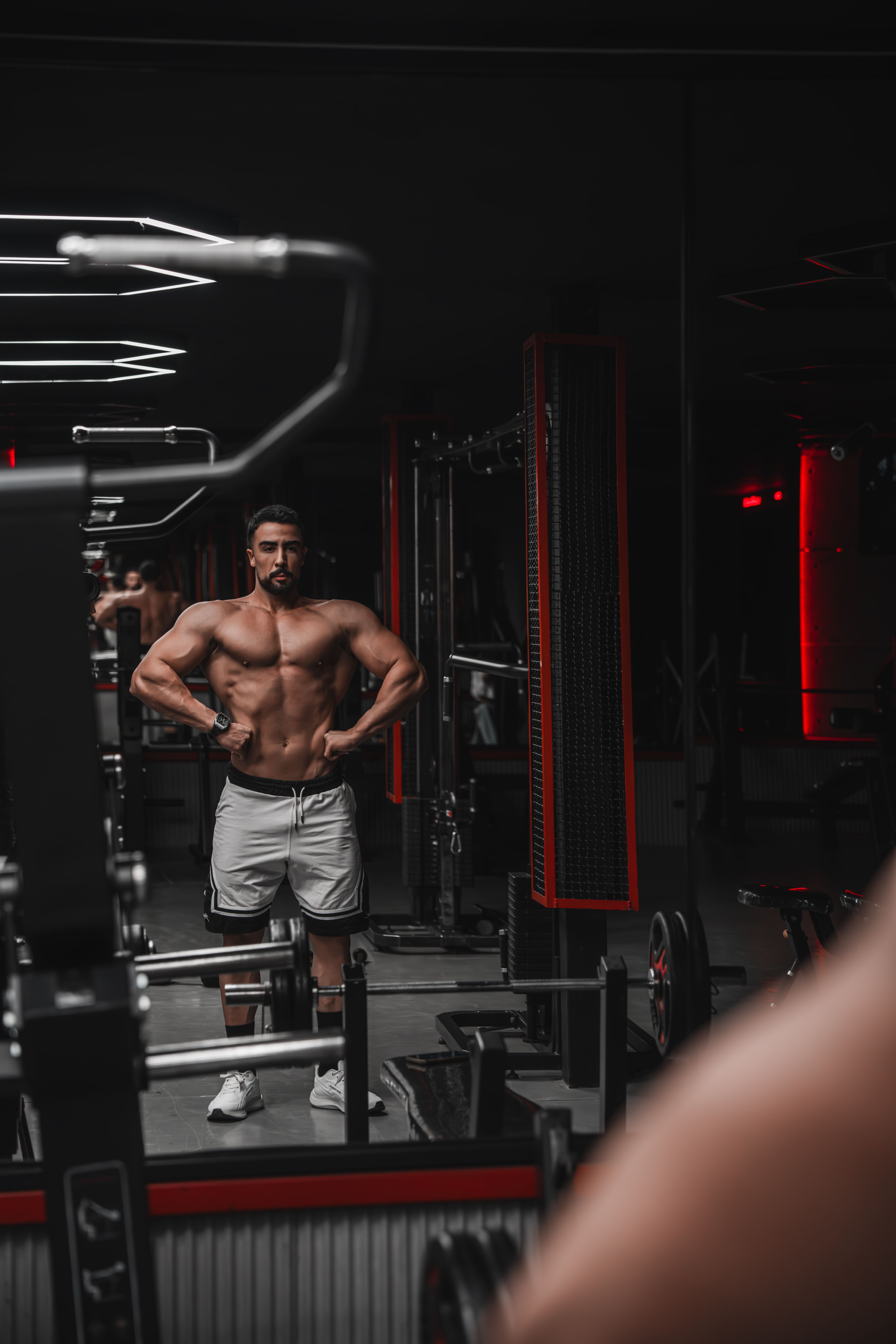 Muscular Man Working Out in Modern Gym · Free Stock Photo